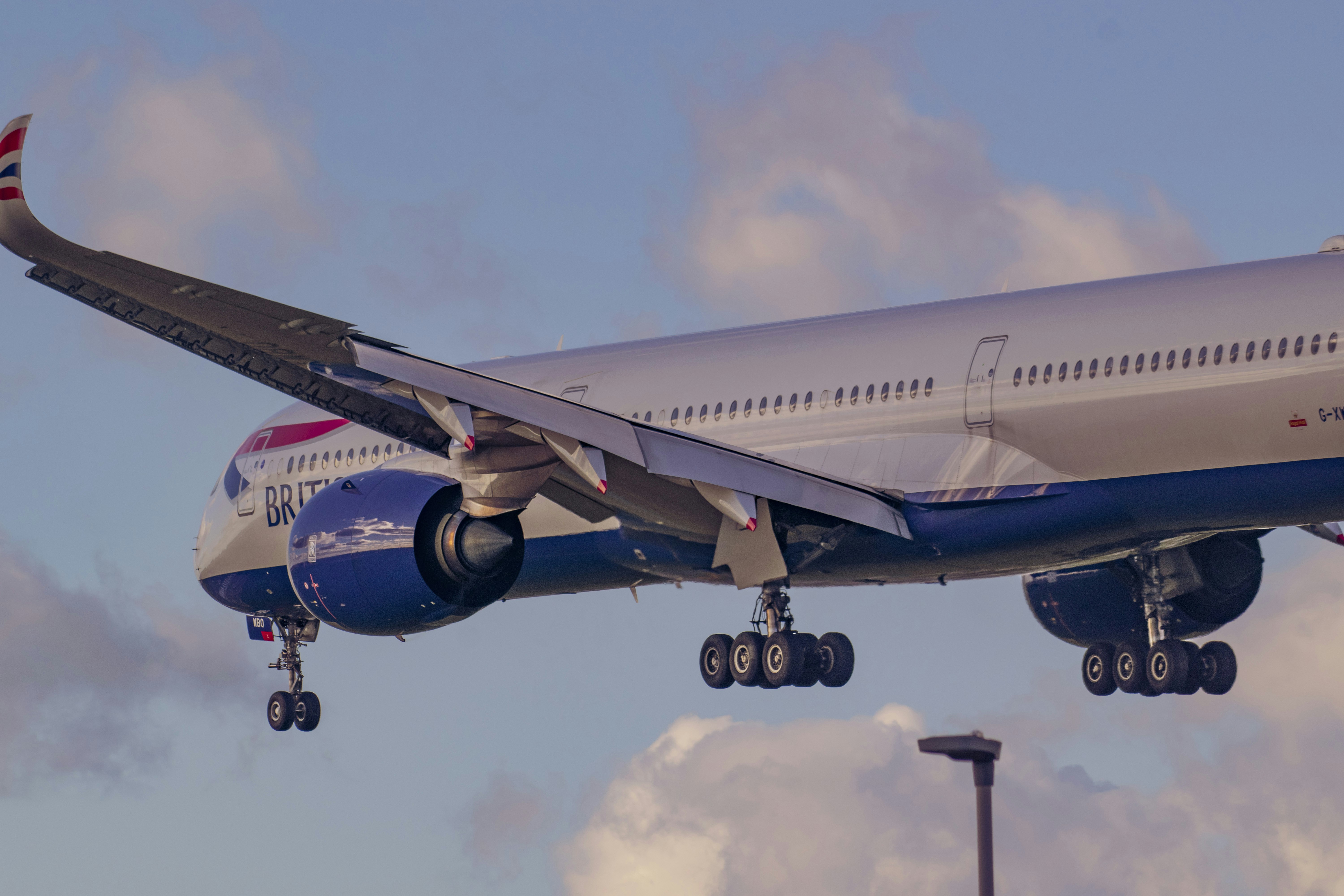 Winged Giant in Approach: A British Airways A380 Descends Over Cloudscape
