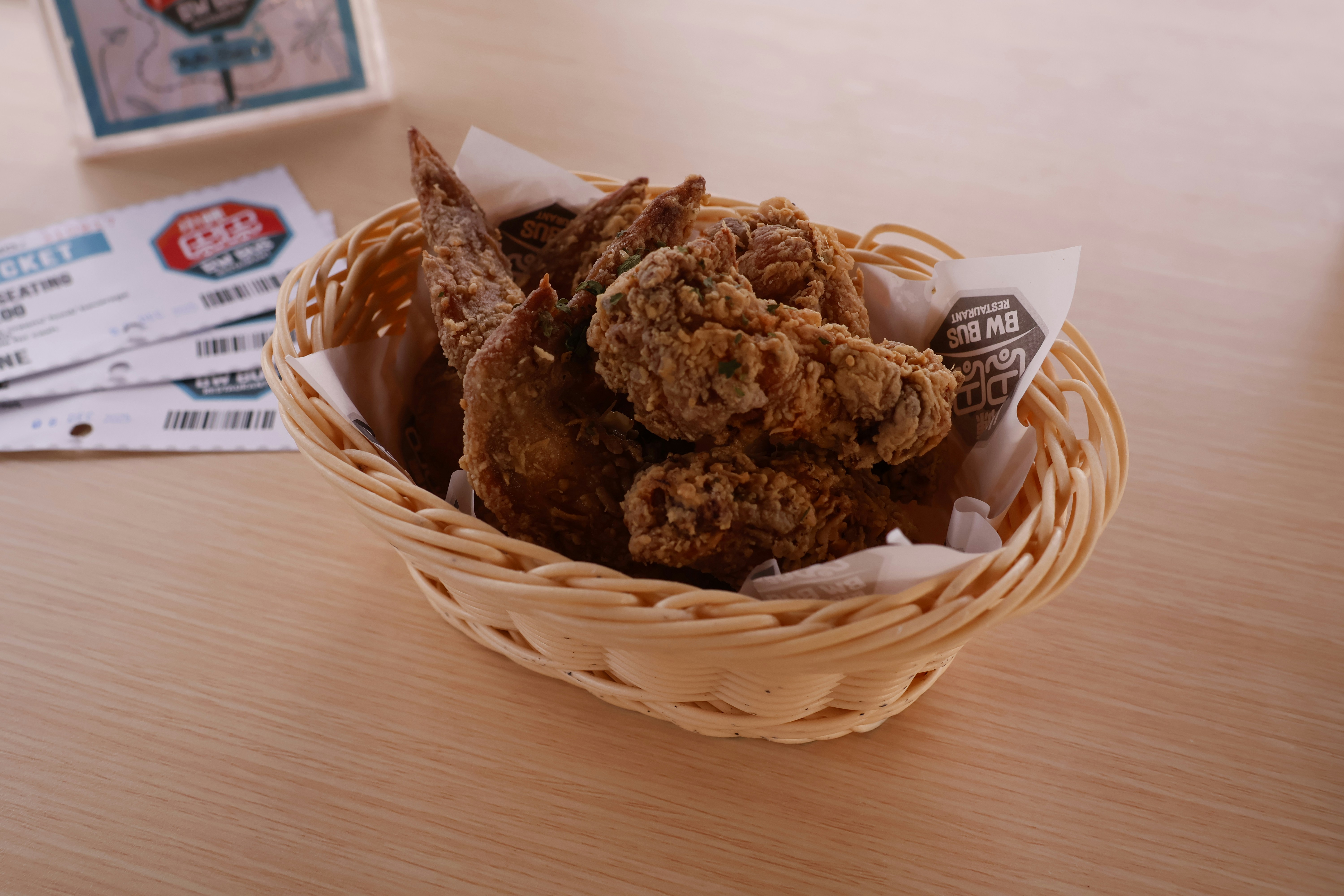 Basket of Crispy Fried Chicken Bits on a Clean Table
