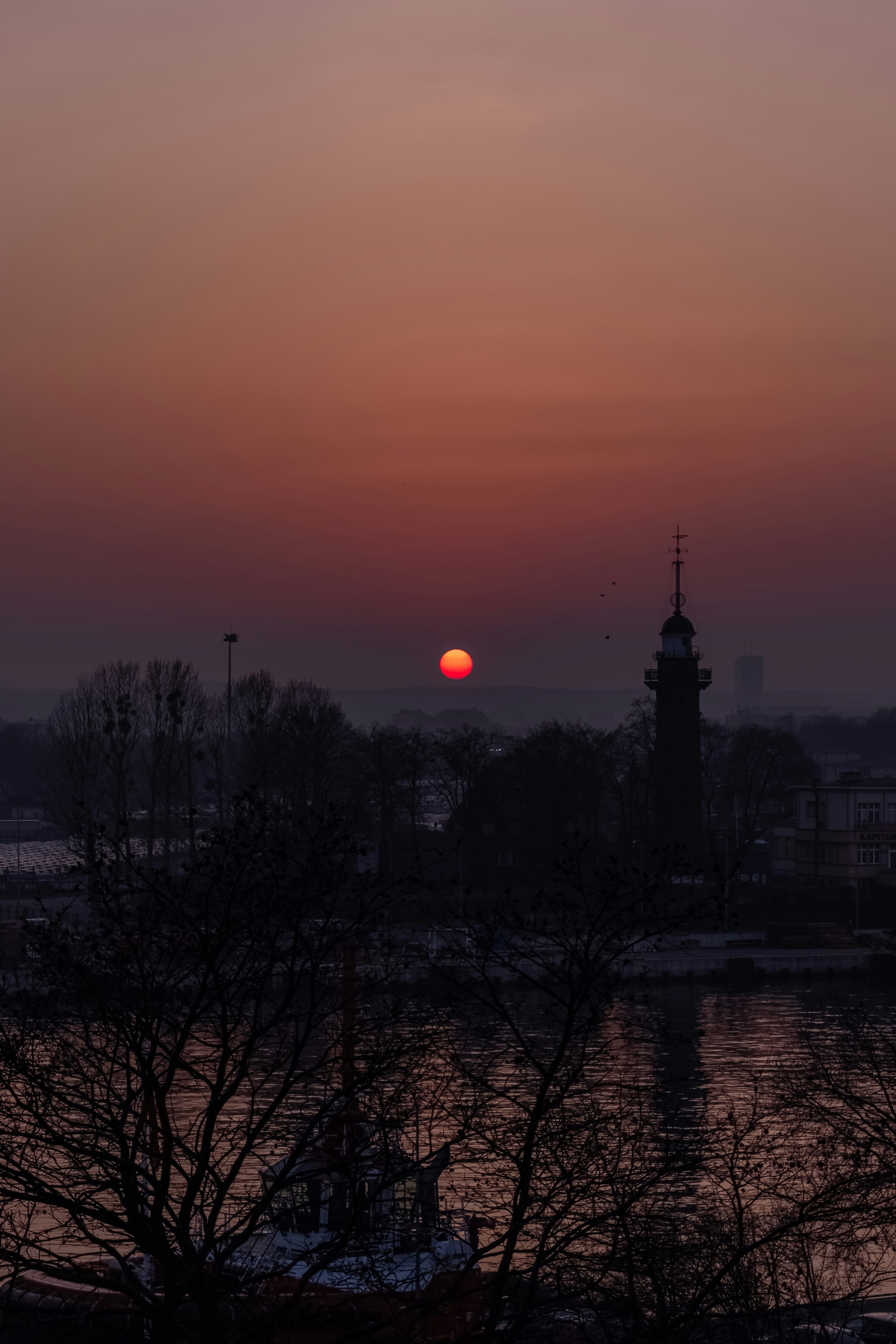 Sinking Sun Over the Silhouetted Waterfront