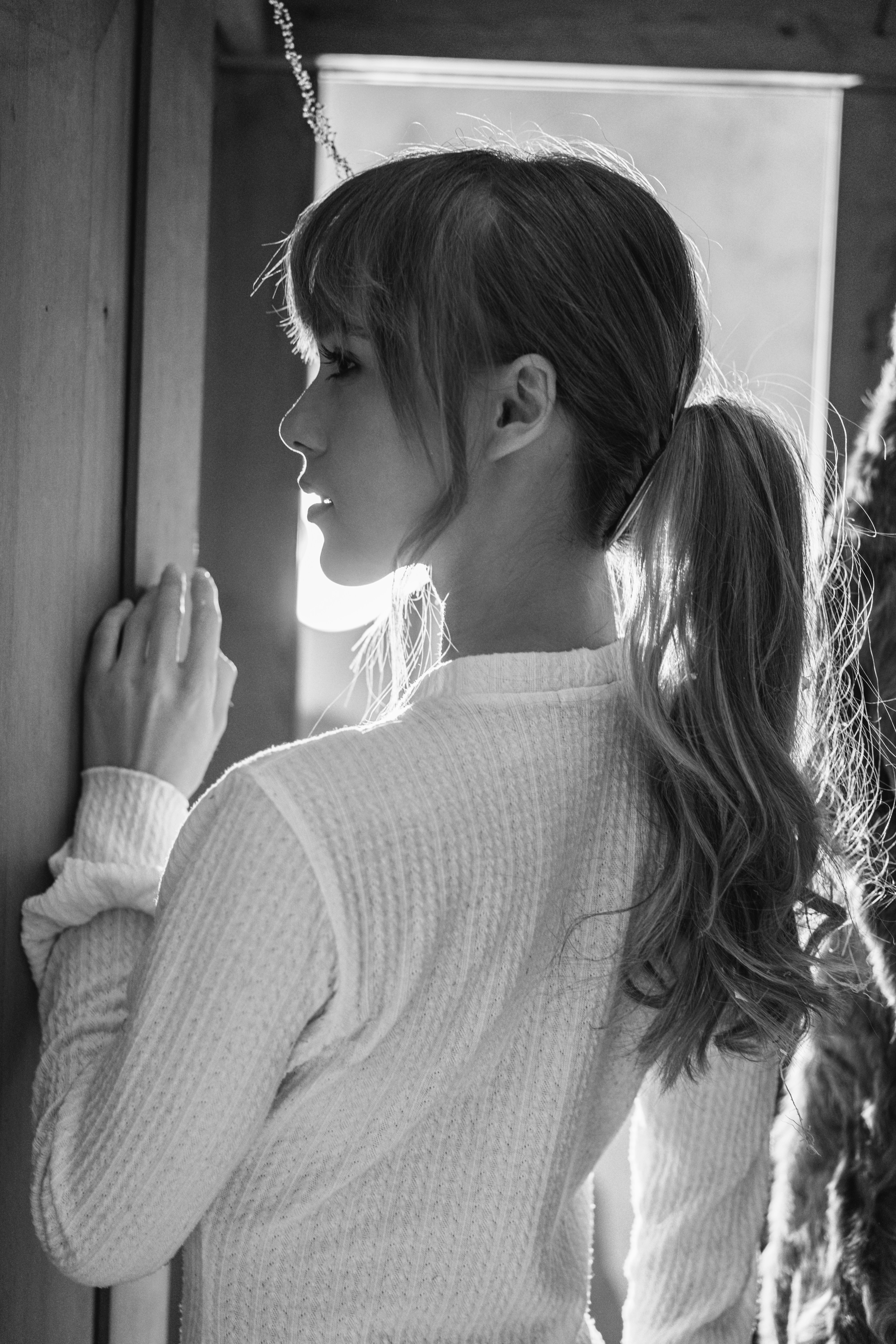 Private Moment by the Window: A Soft Noir Portrait