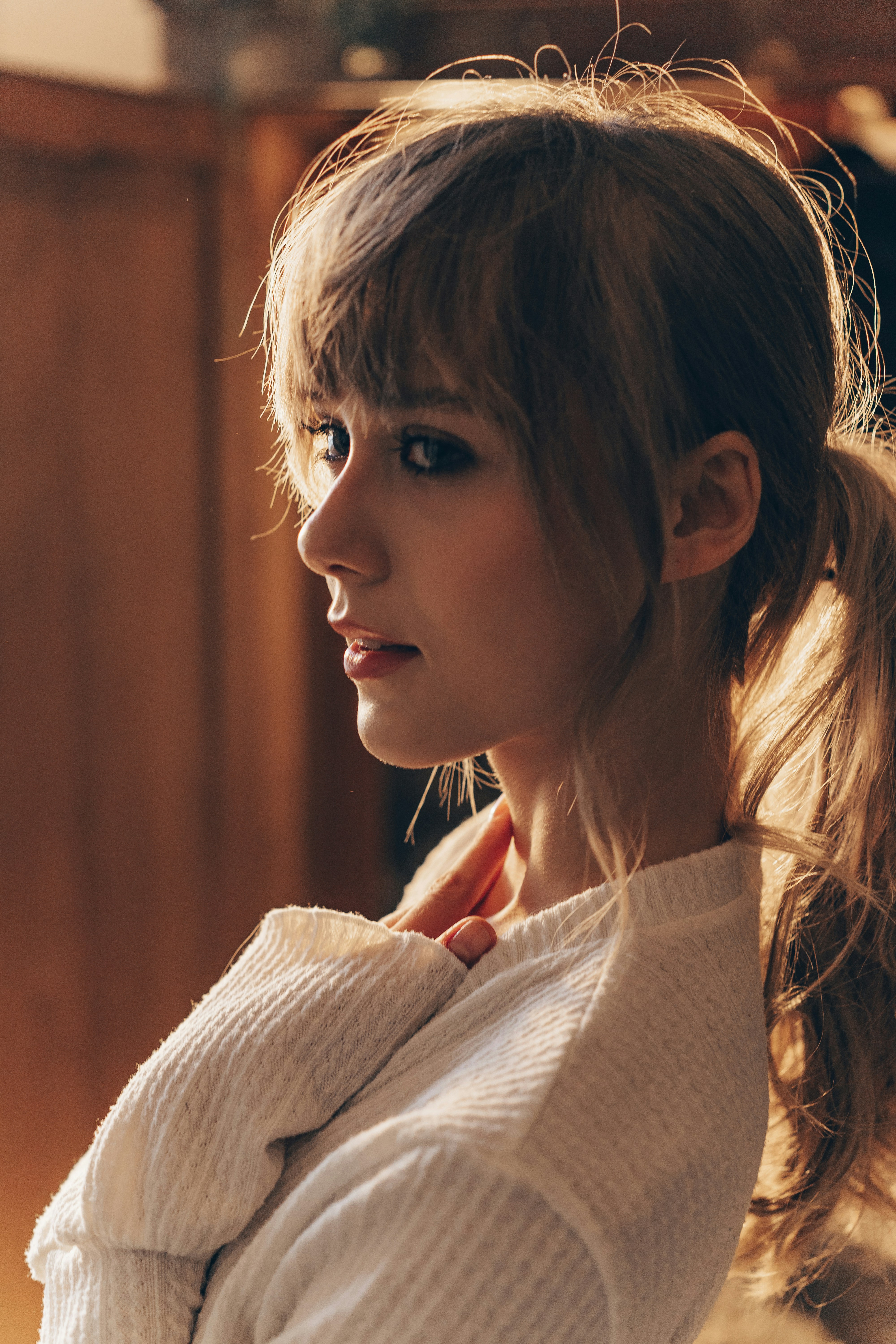 Soft Backlight Portrait of a Young Woman in Warm Corner Light