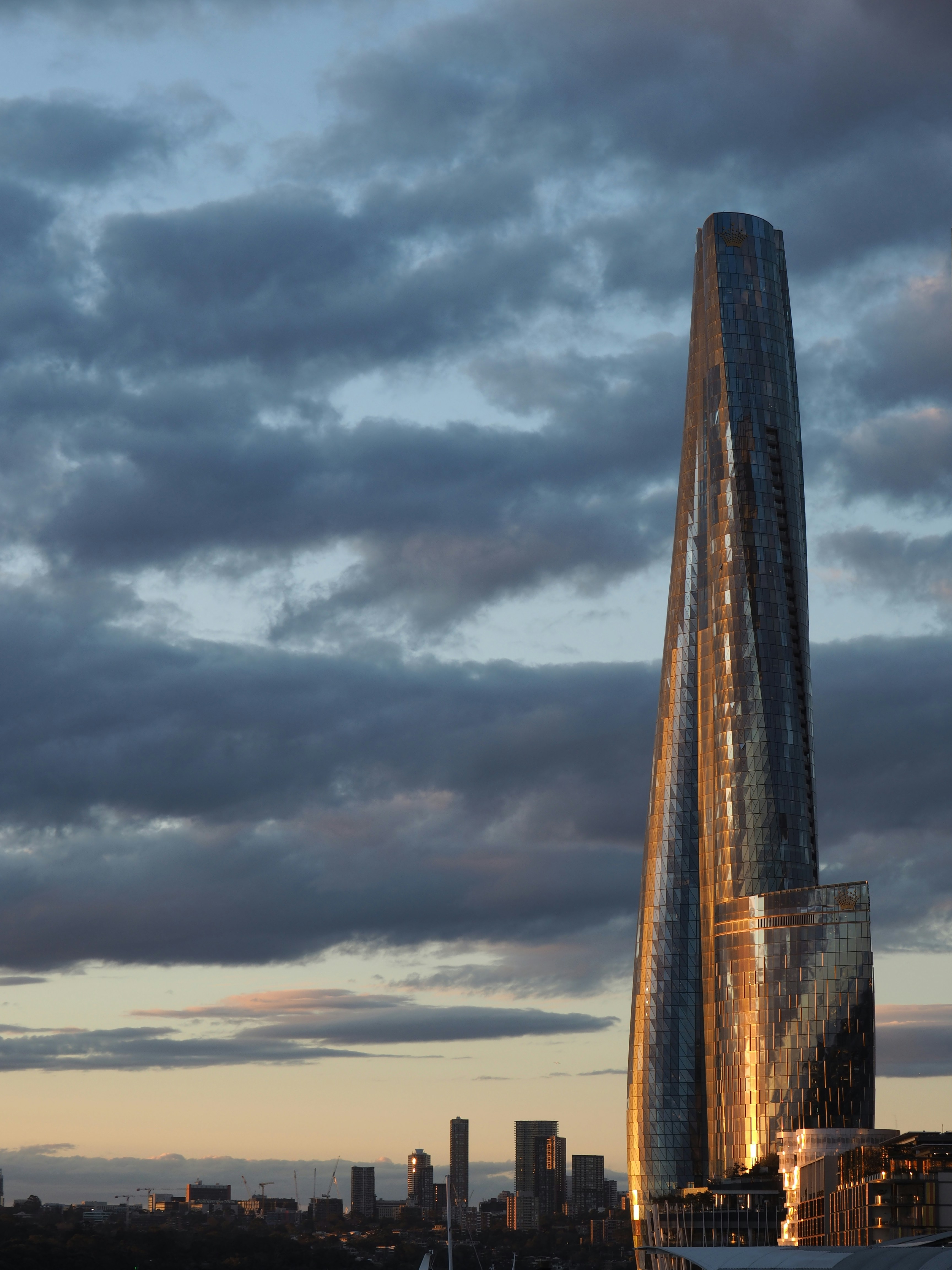 Sunlit Facets: The Spiral Tower Pierces the Evening Sky