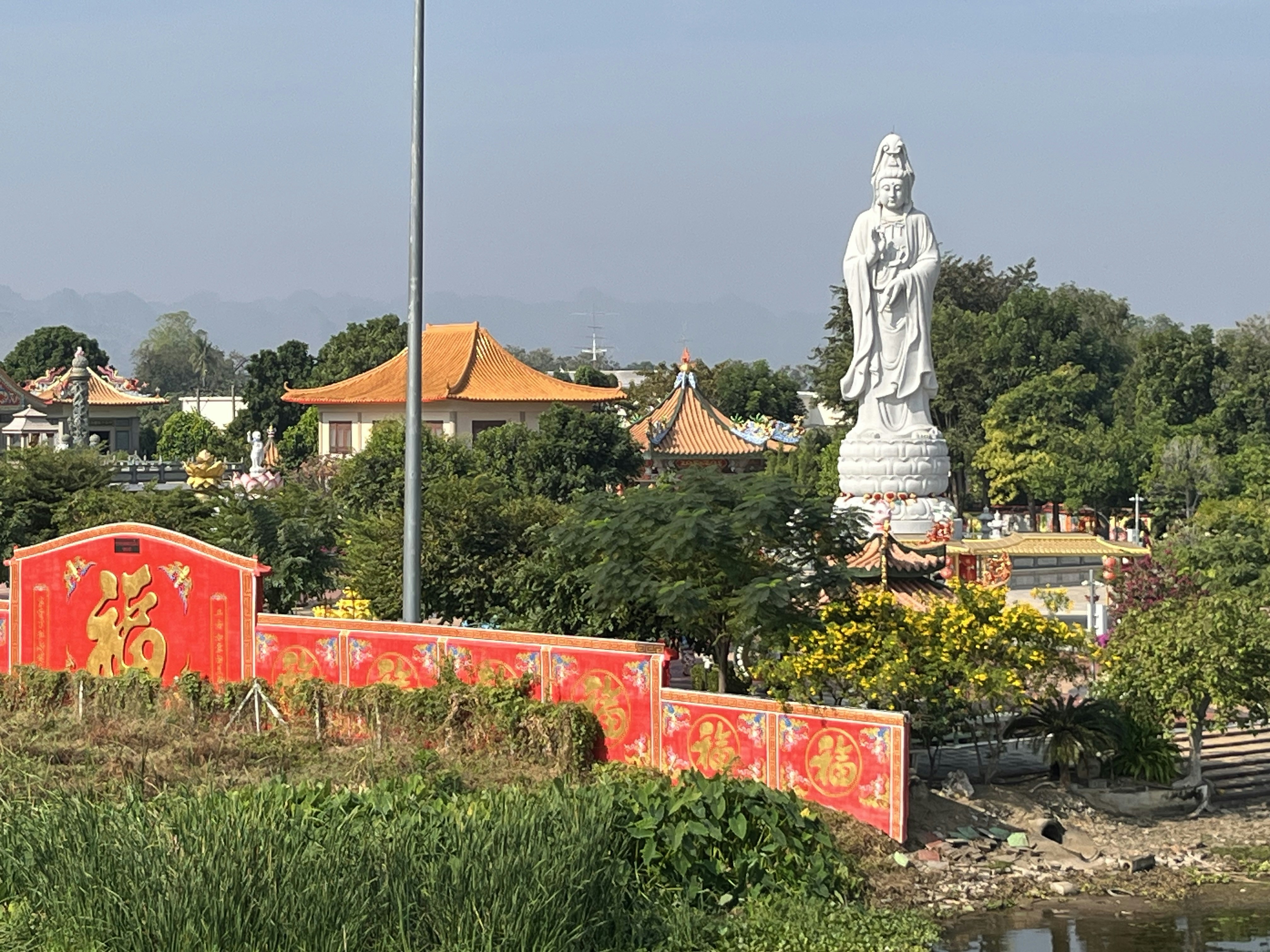 Stone Guardian Overlooked by Red Ribbons: A Temple Courtyard Portrait
