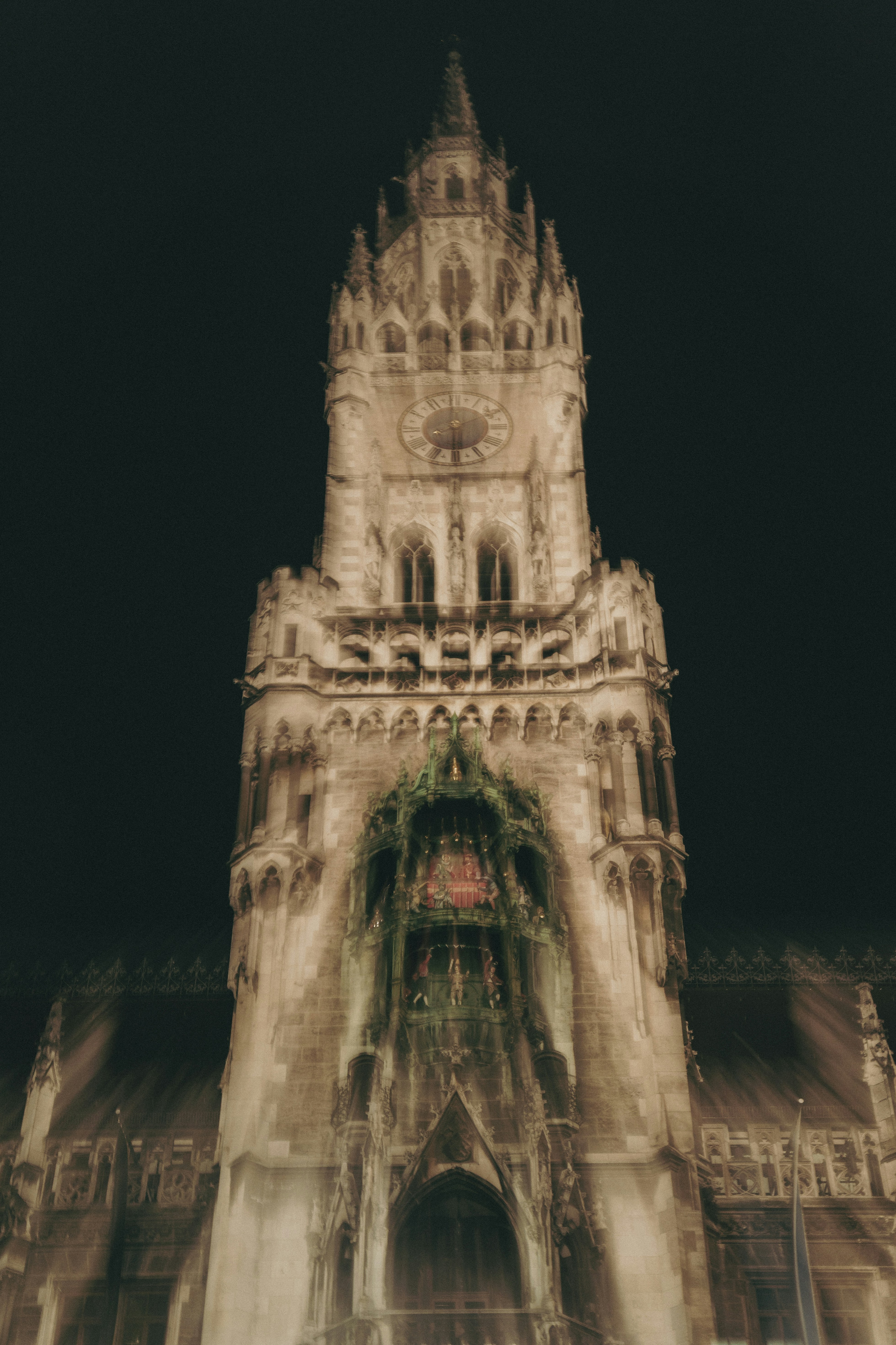 Gothic Clocktower Aglow: Nighttime ascent of a towering spire