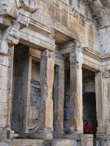 Stone Colonnade Echoes: A Lone Visitor in Ancient Silence
