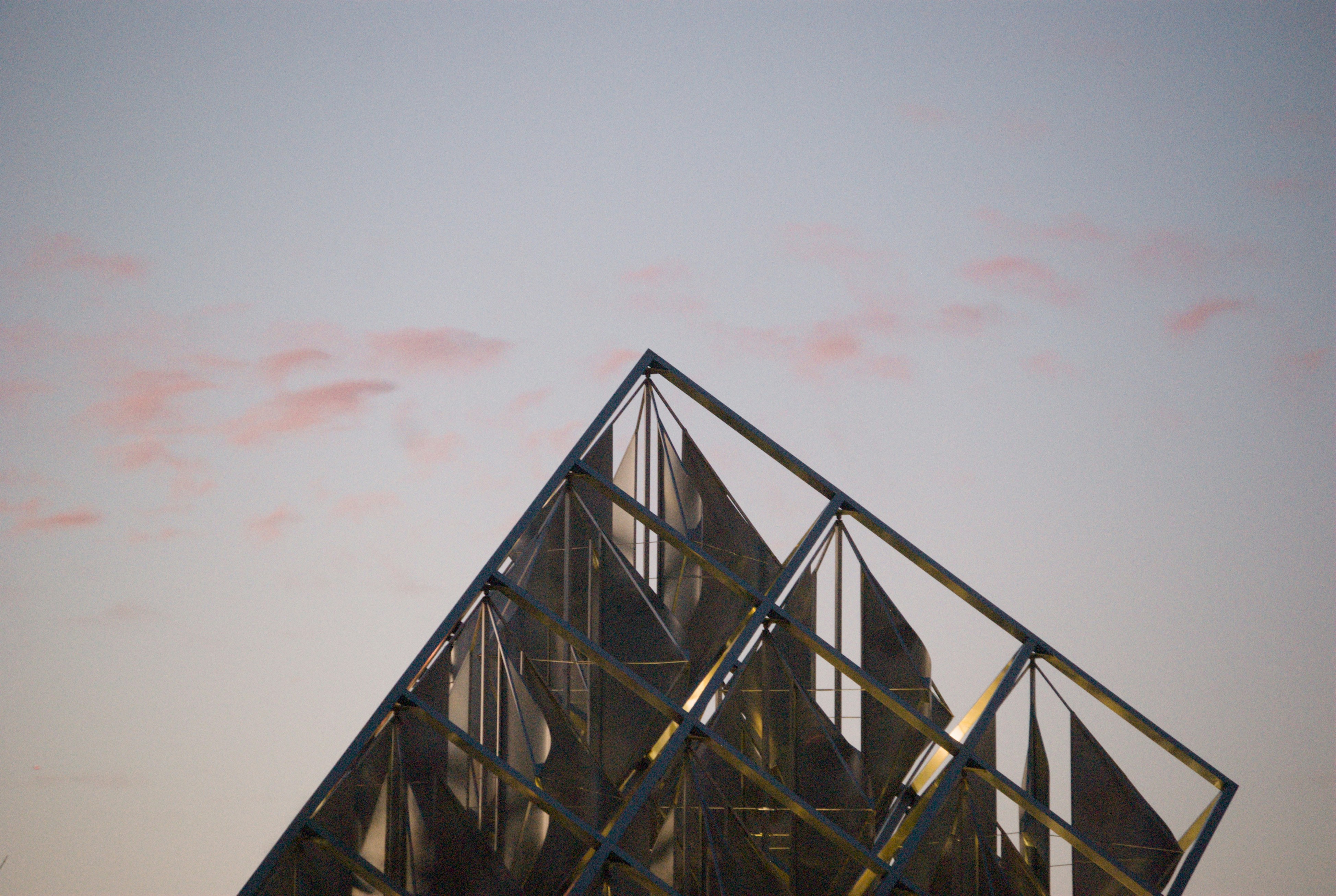 Pyramid Silk: The Geometric Peak Against a Pink Sky