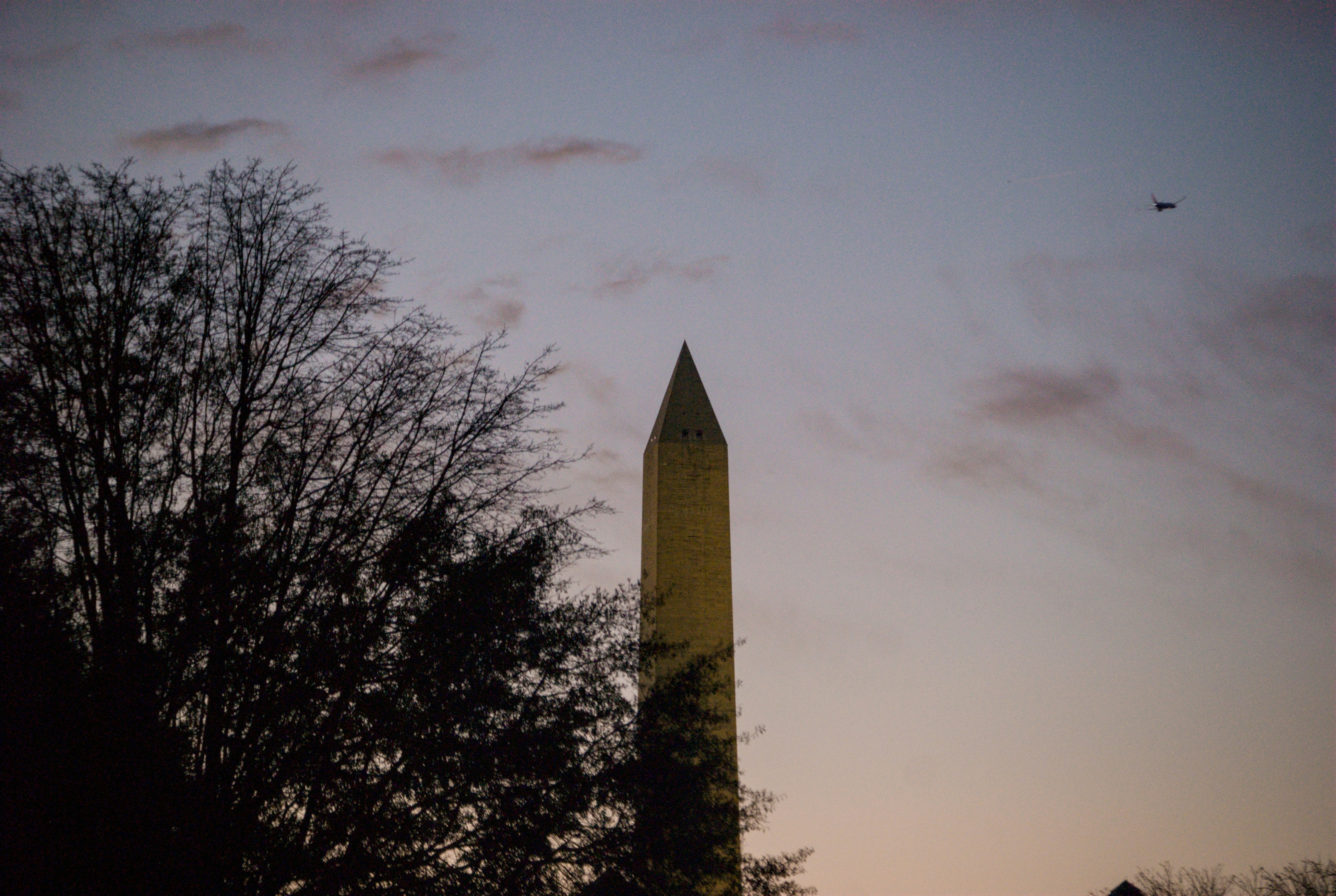 Dusk Over the Obelisk: Narrow silhouette against a pale sky