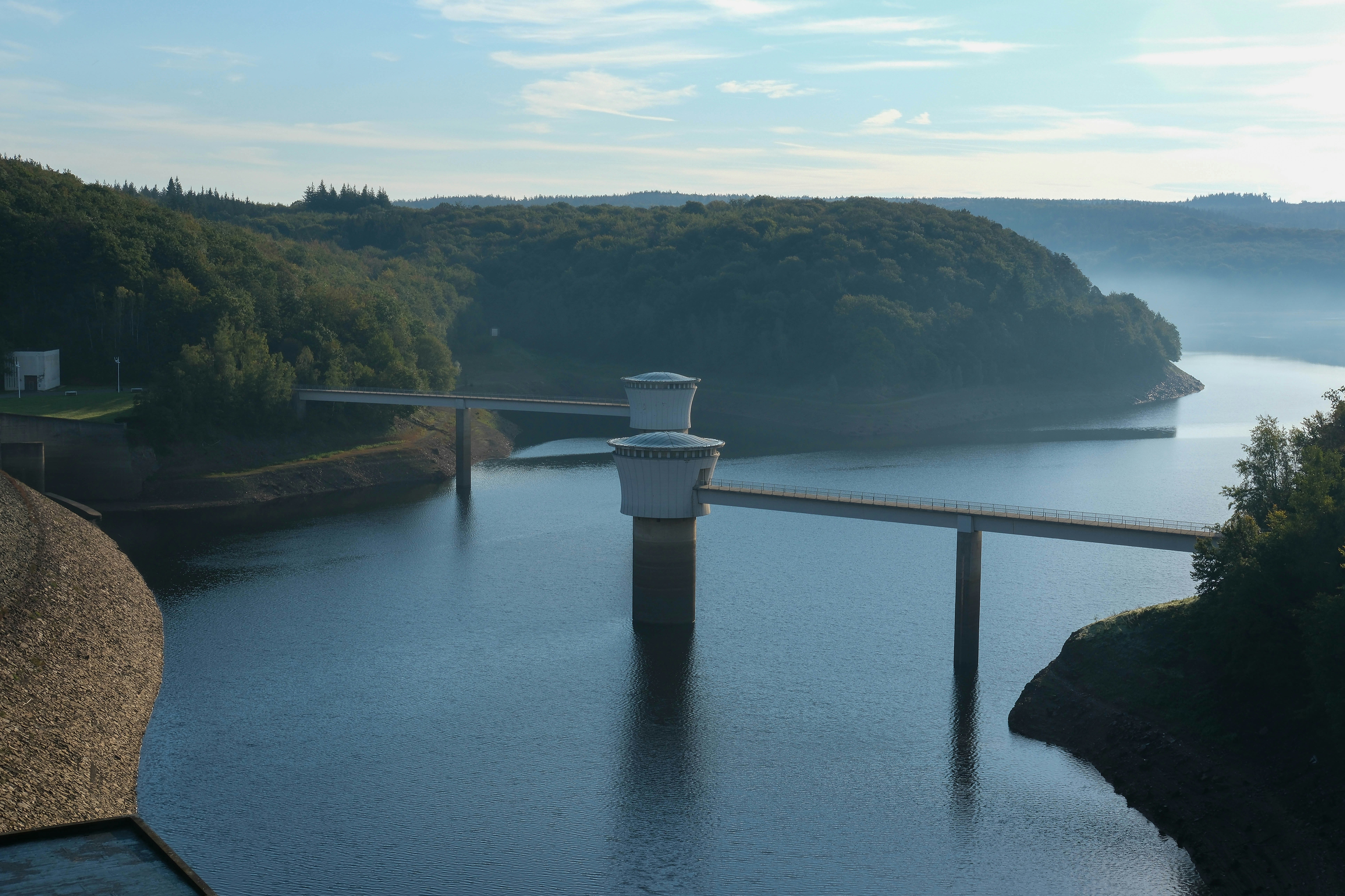Quiet Conduit: A Dam Spanning Serene Waters