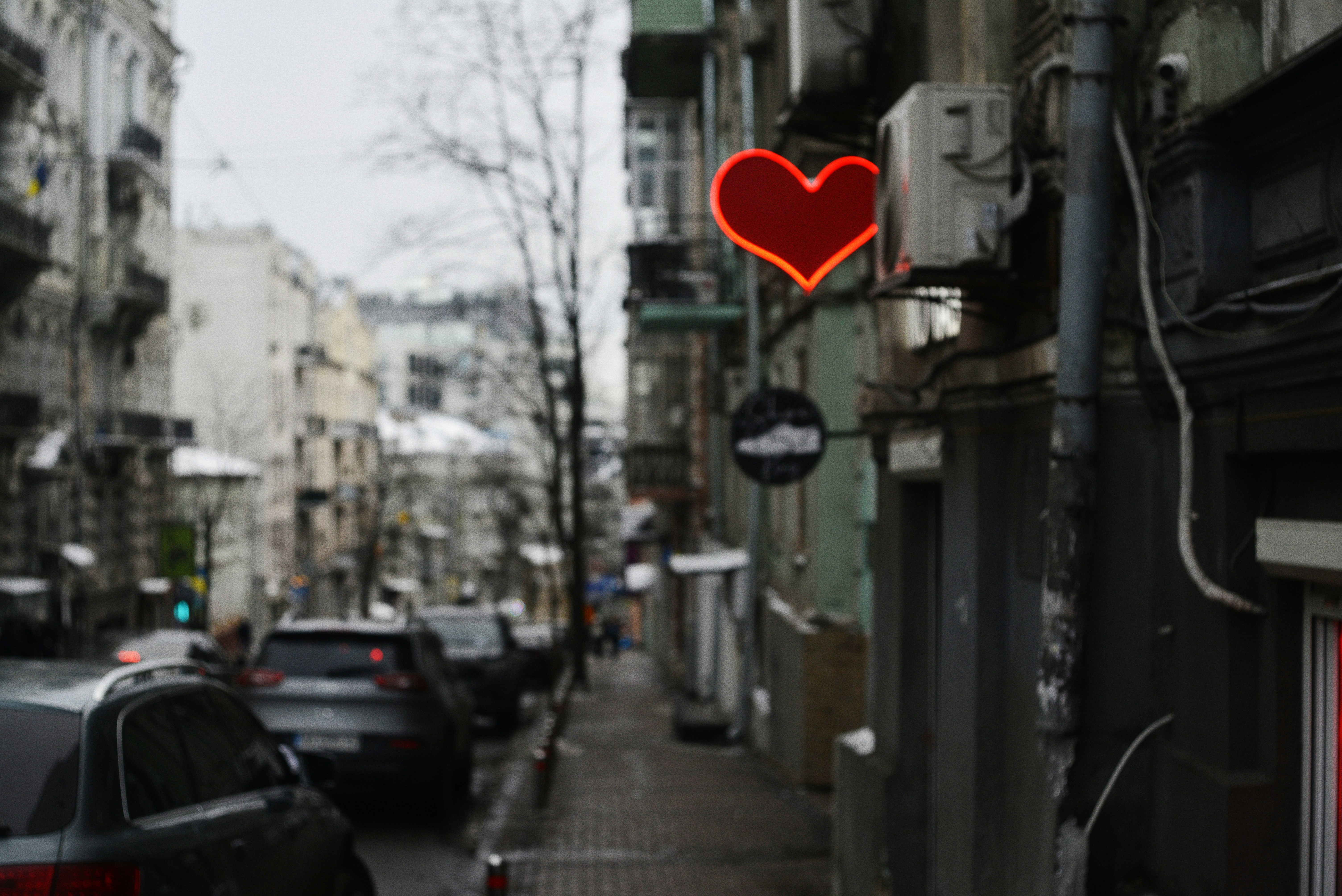 Neon Heart Above a Quiet City Street