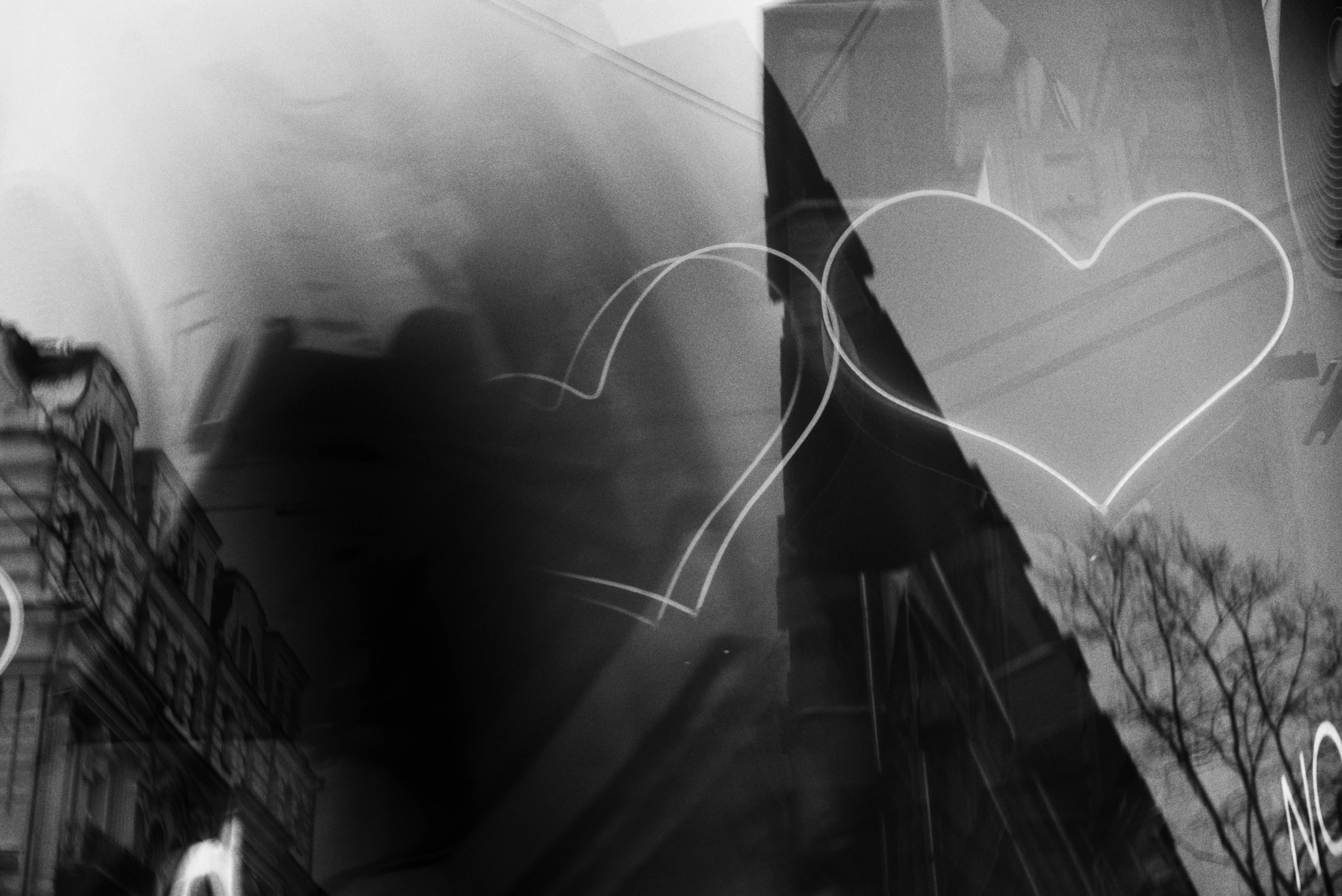 Neon Hearts Over a City Silhouette