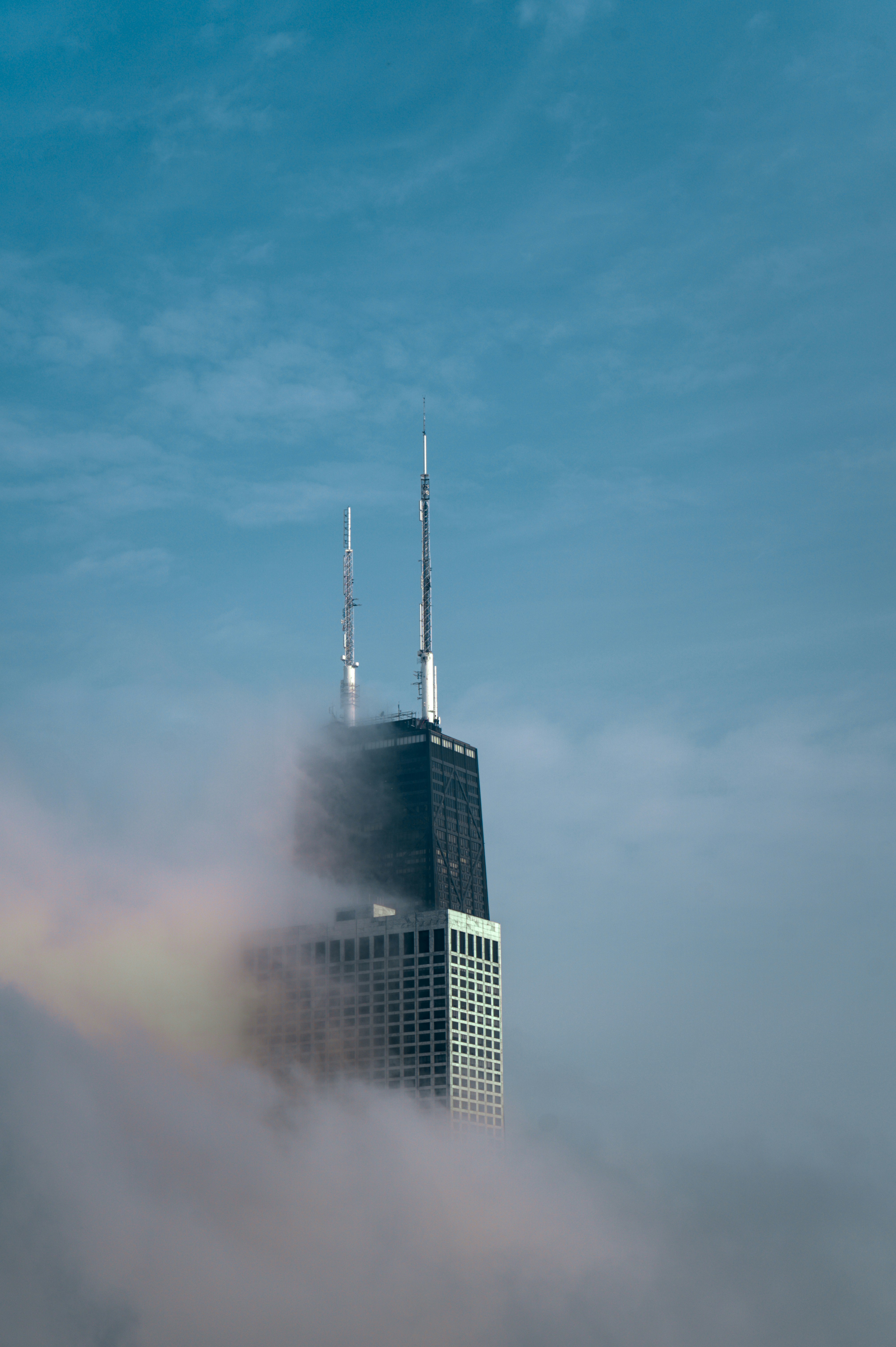 Top of the City: The Willis Tower Rises Through a Veil of Clouds