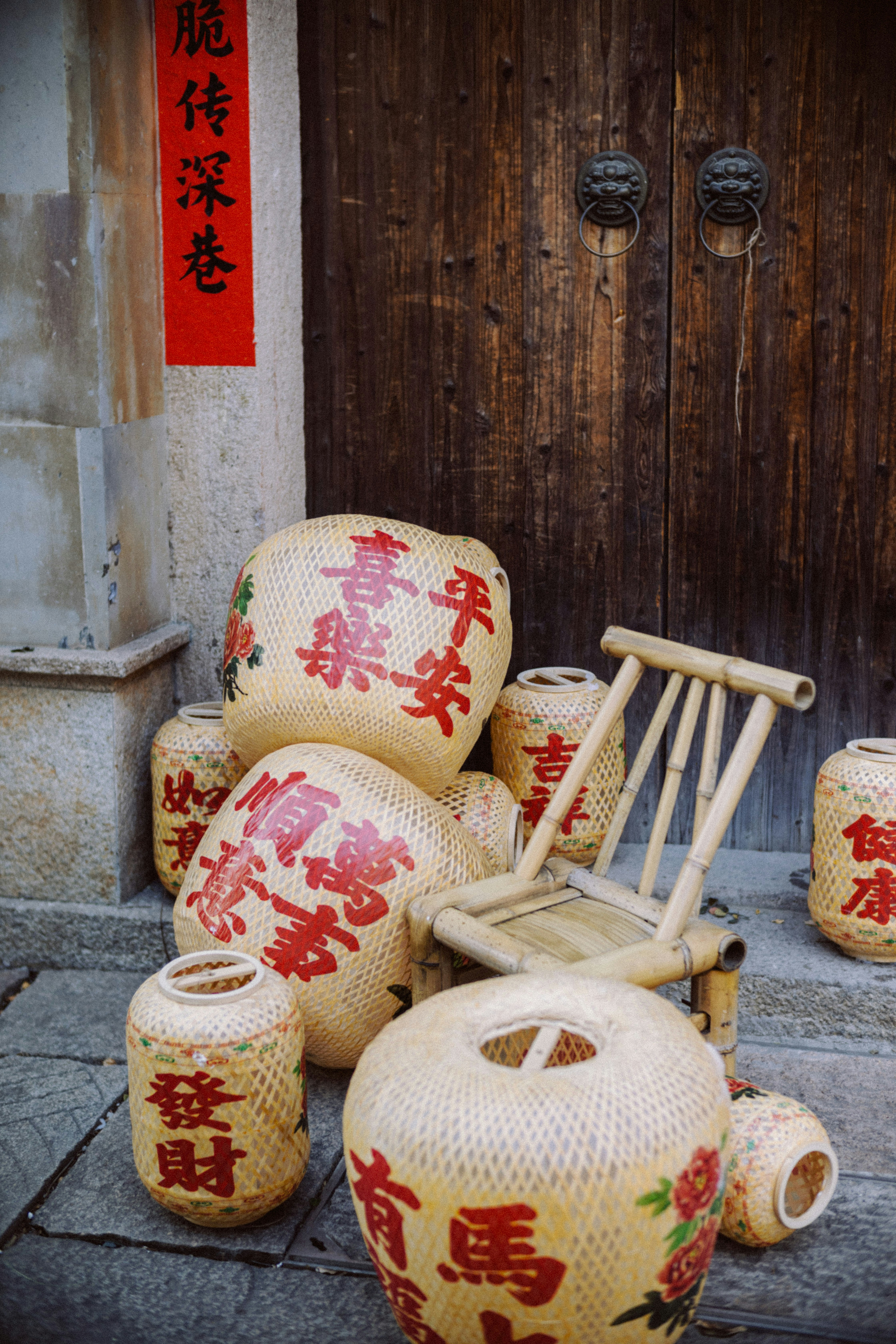Red-scripted Lanterns and Oak-Door Stillness