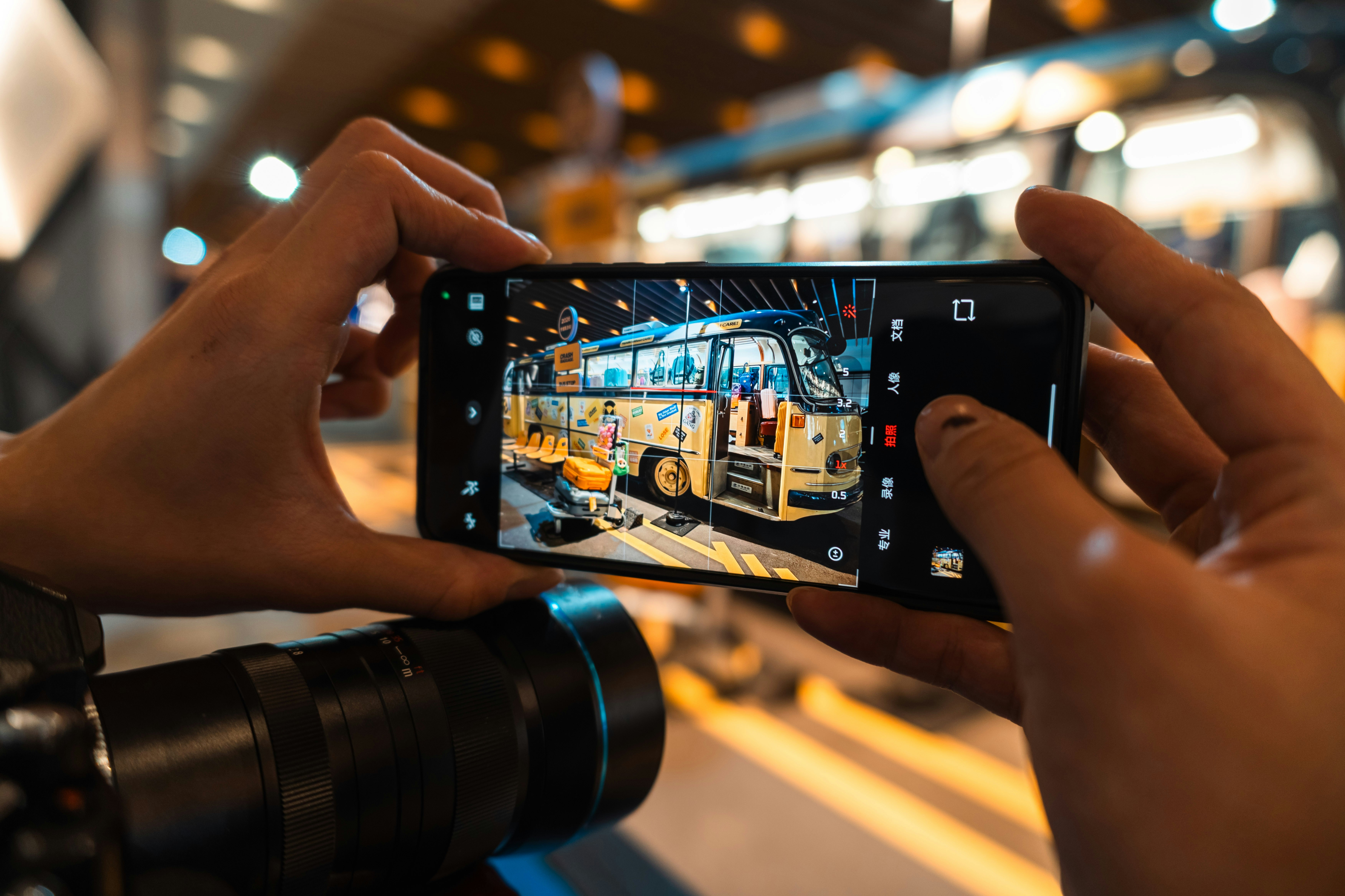 Framing the Console: A Hands-On Shot of Captured Bus Scene through a Smartphone