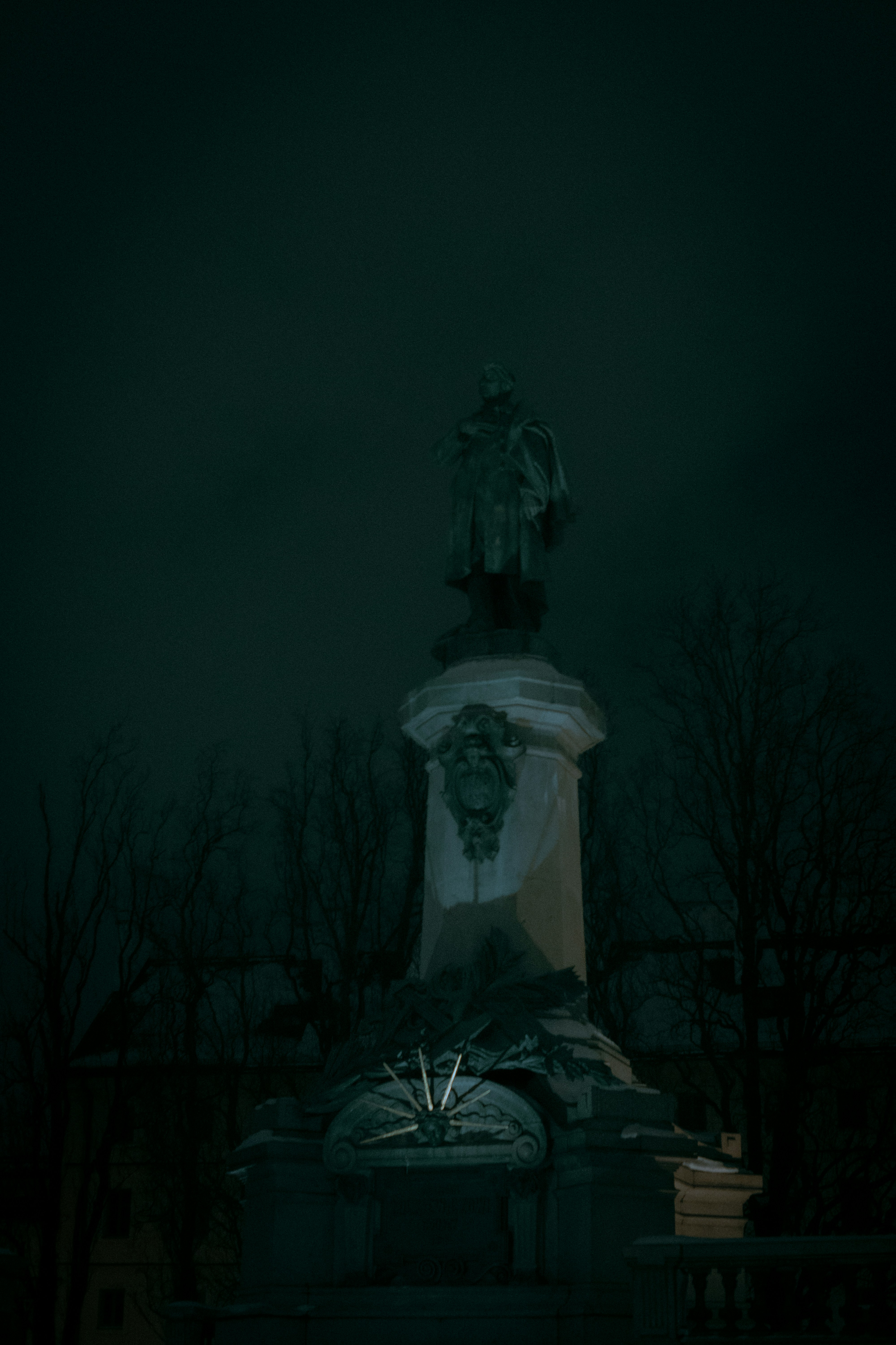 Moonlit Monument: A Silent Statue under Nightfall