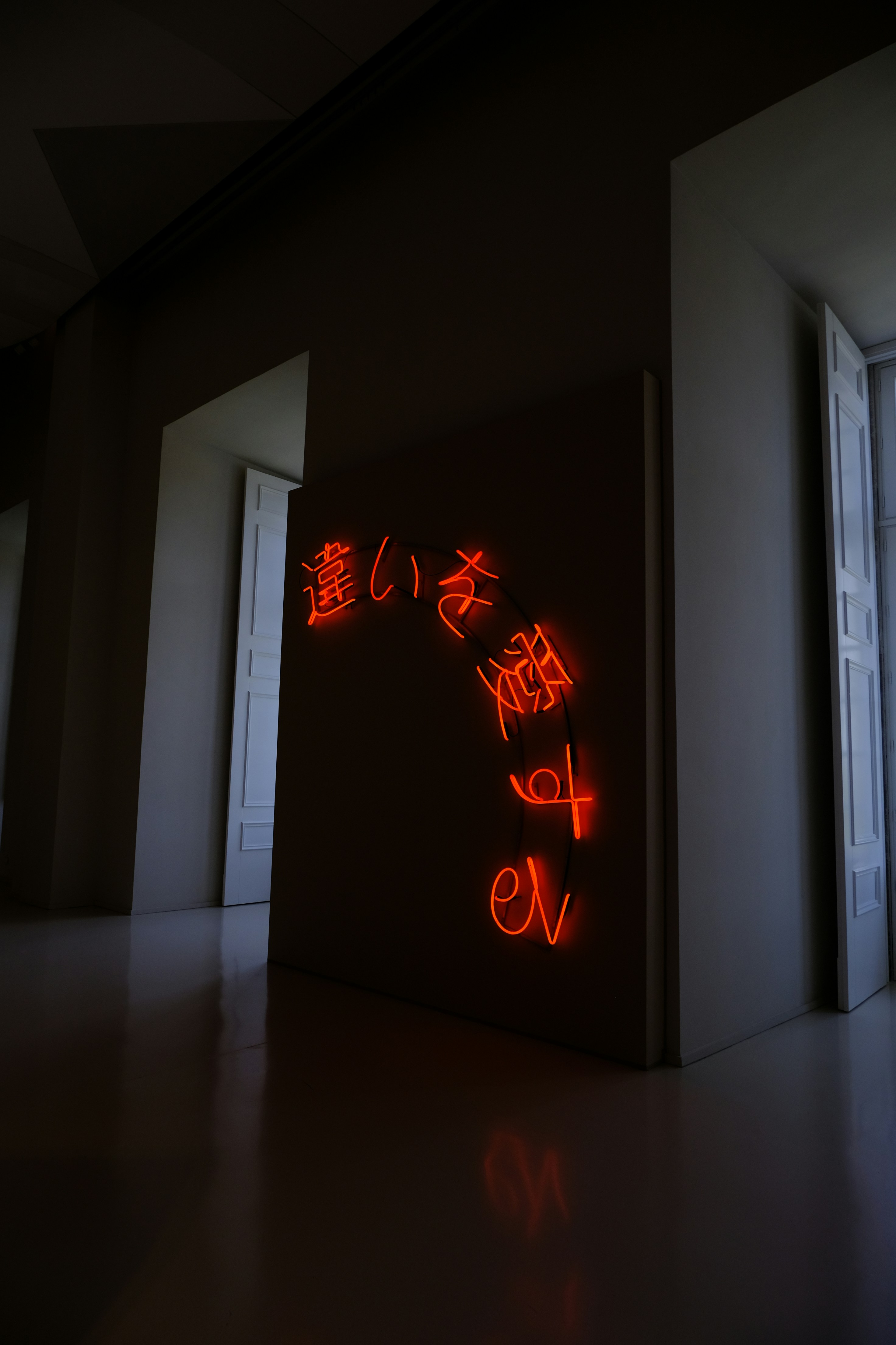 Red Neon Arc in a Dark Corridor