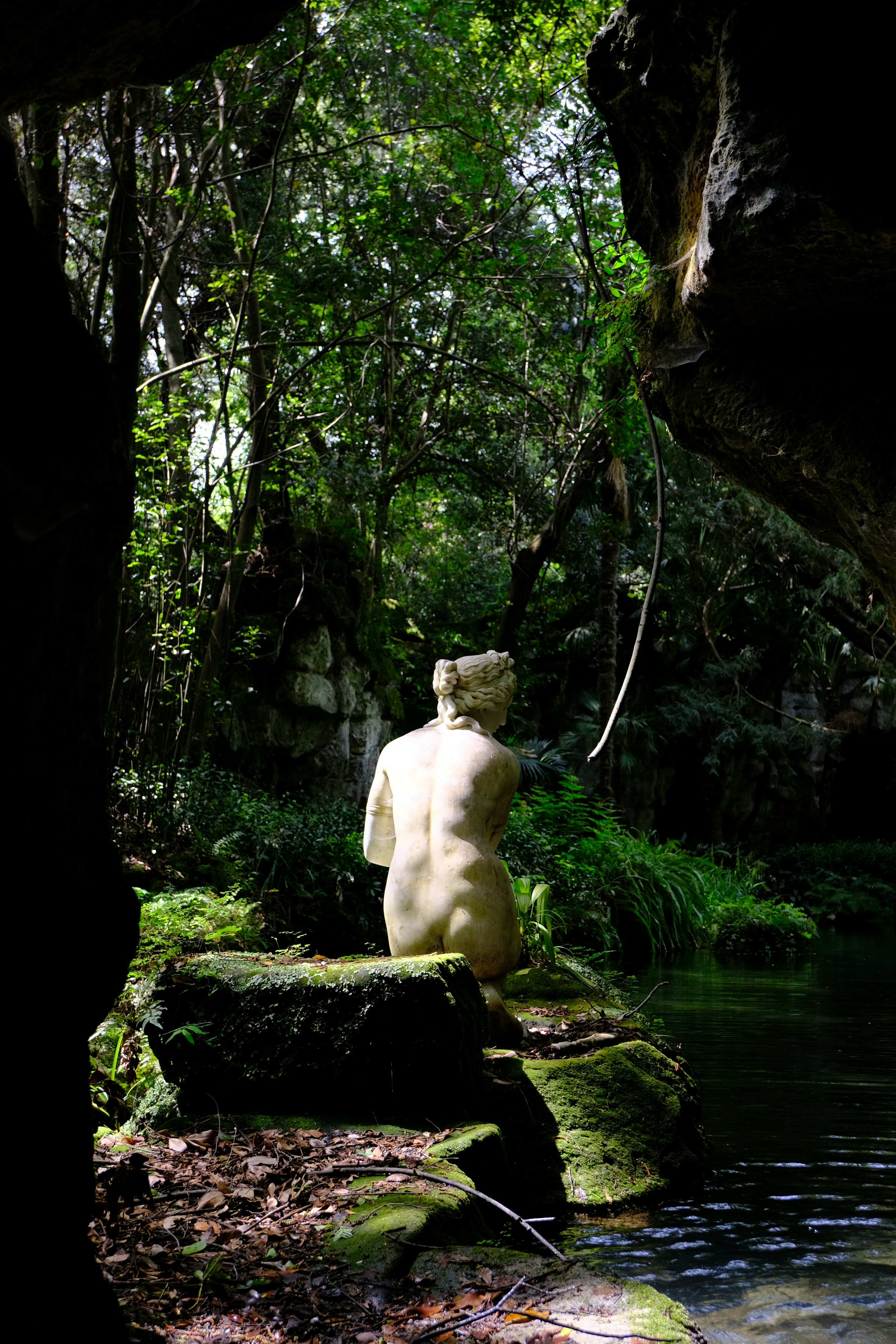 Hidden Goddess by the Pond: A Limestone Figure Surfaces in Quiet Garden Waters