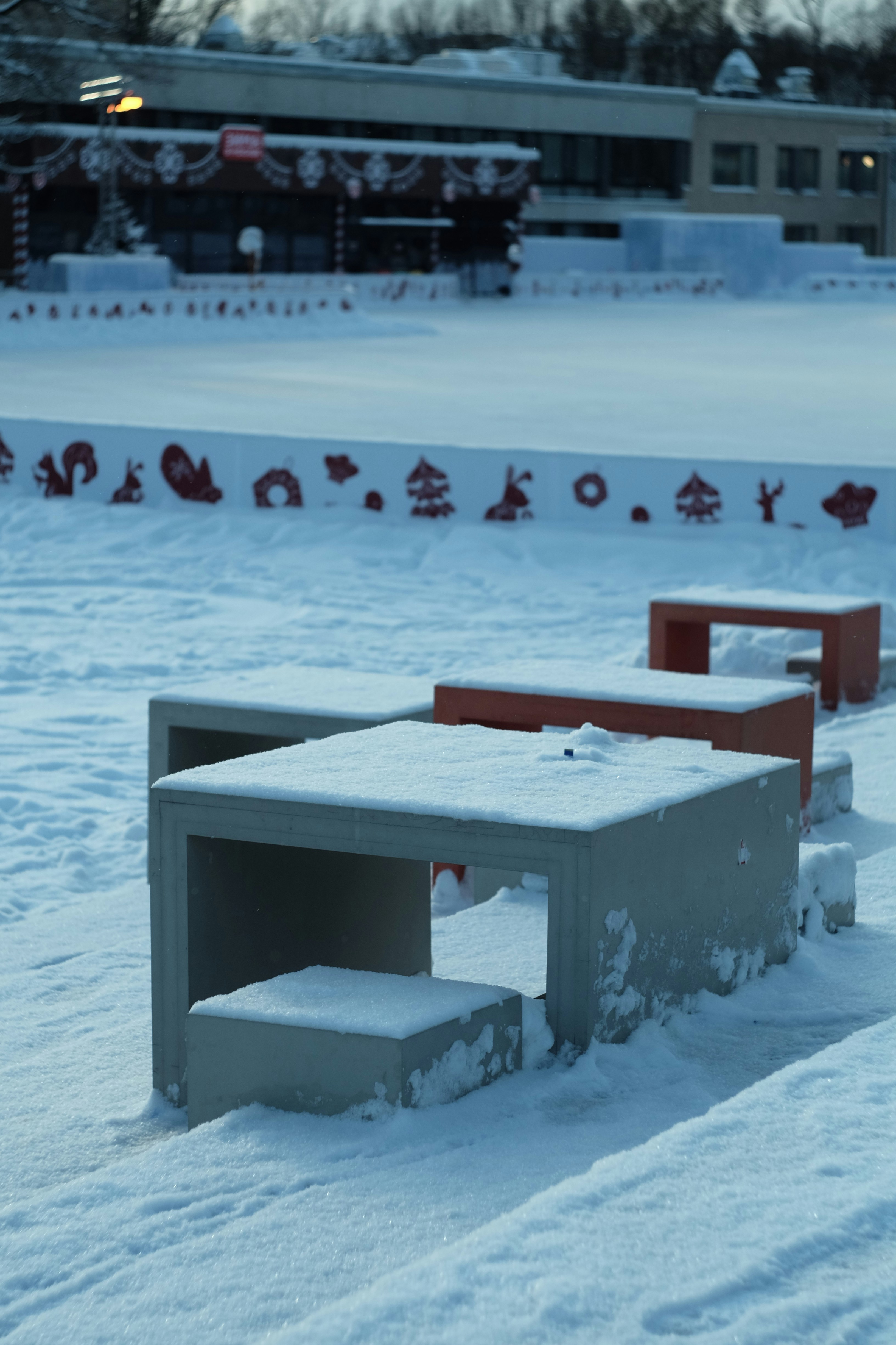 Snowbound Library of Blocks: Modern Benches in a Quiet Winter Square