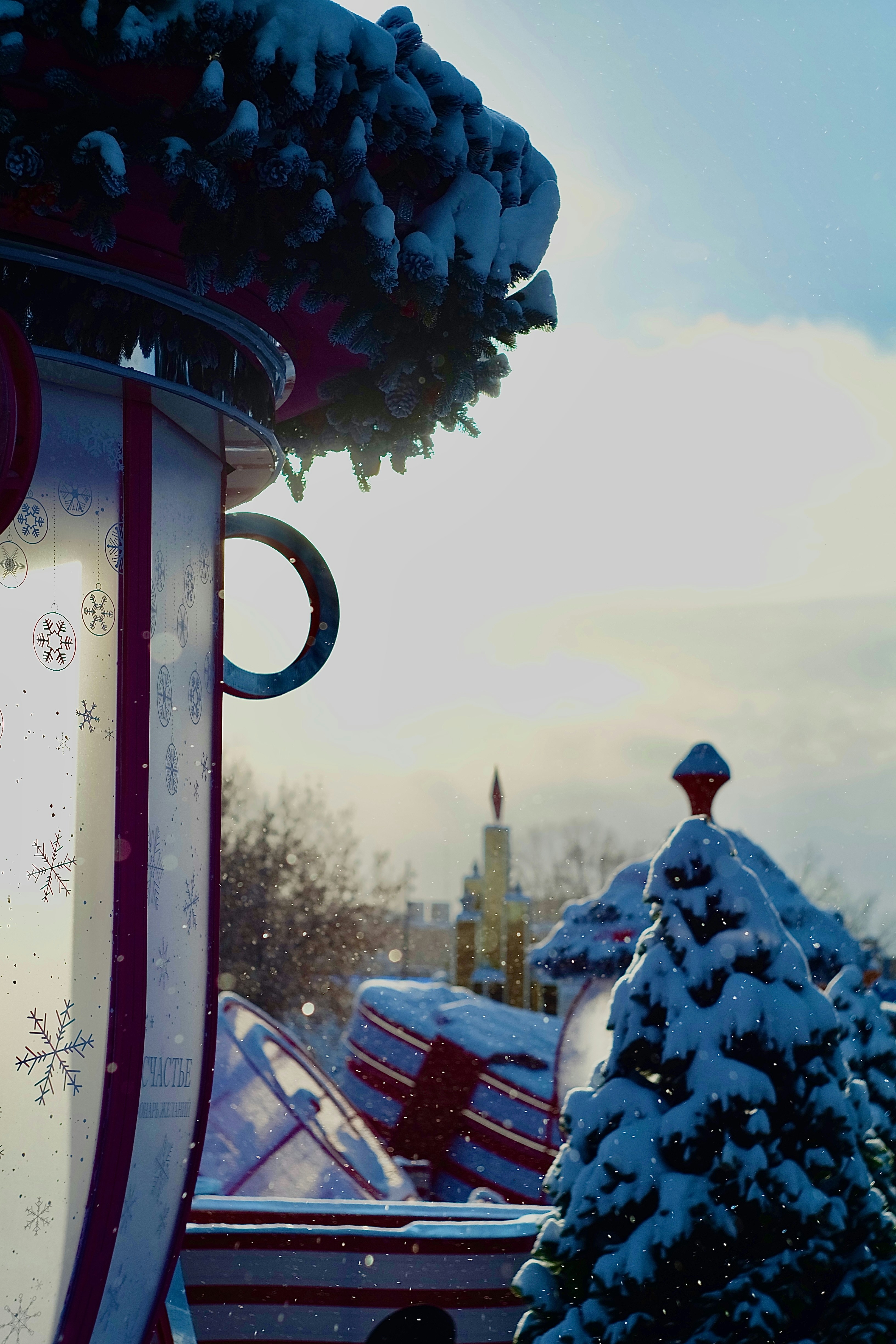 Snowy festive decorations with a castle in background