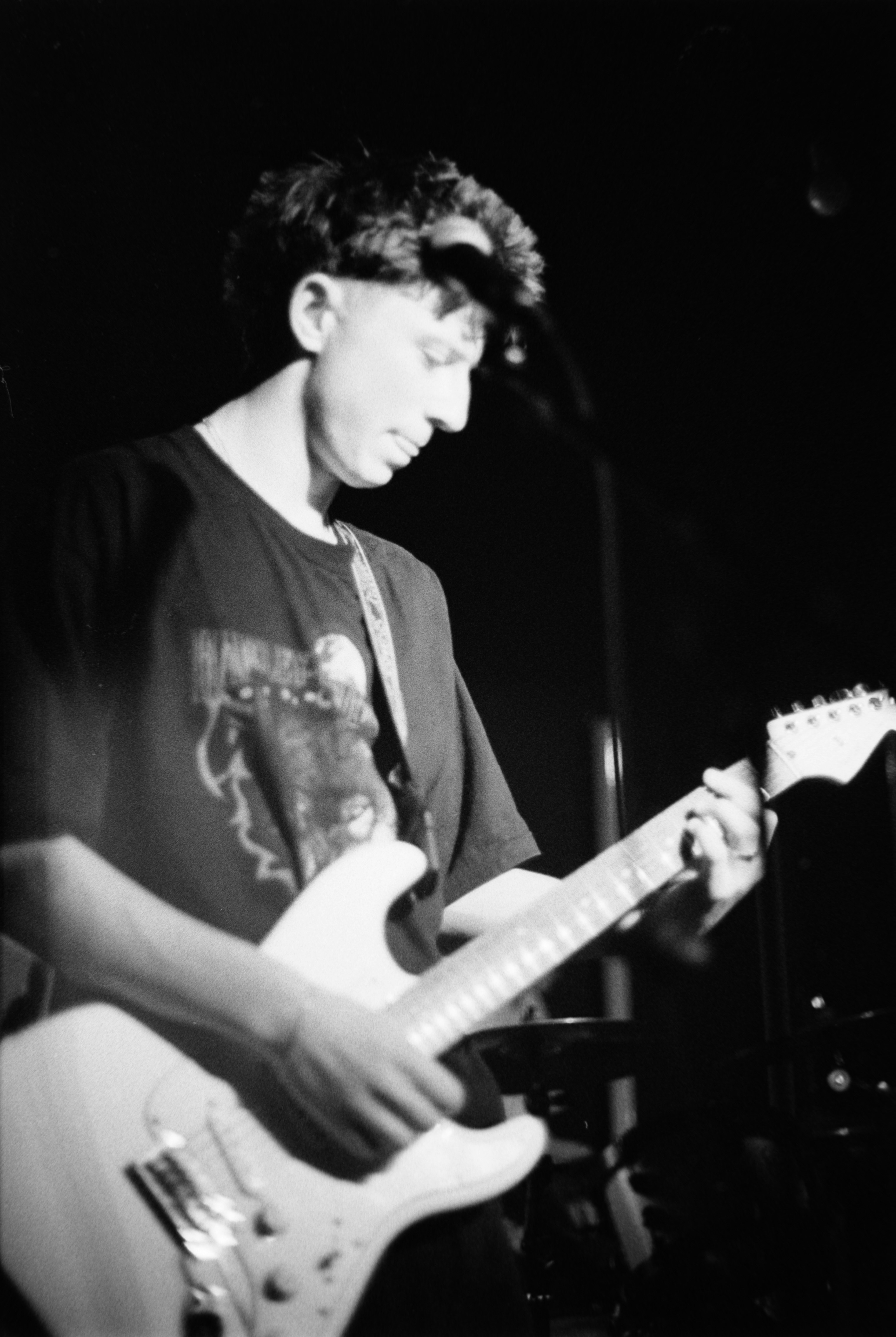 Midnight Strings: A Night Portrait of a guitarist lost in the riff