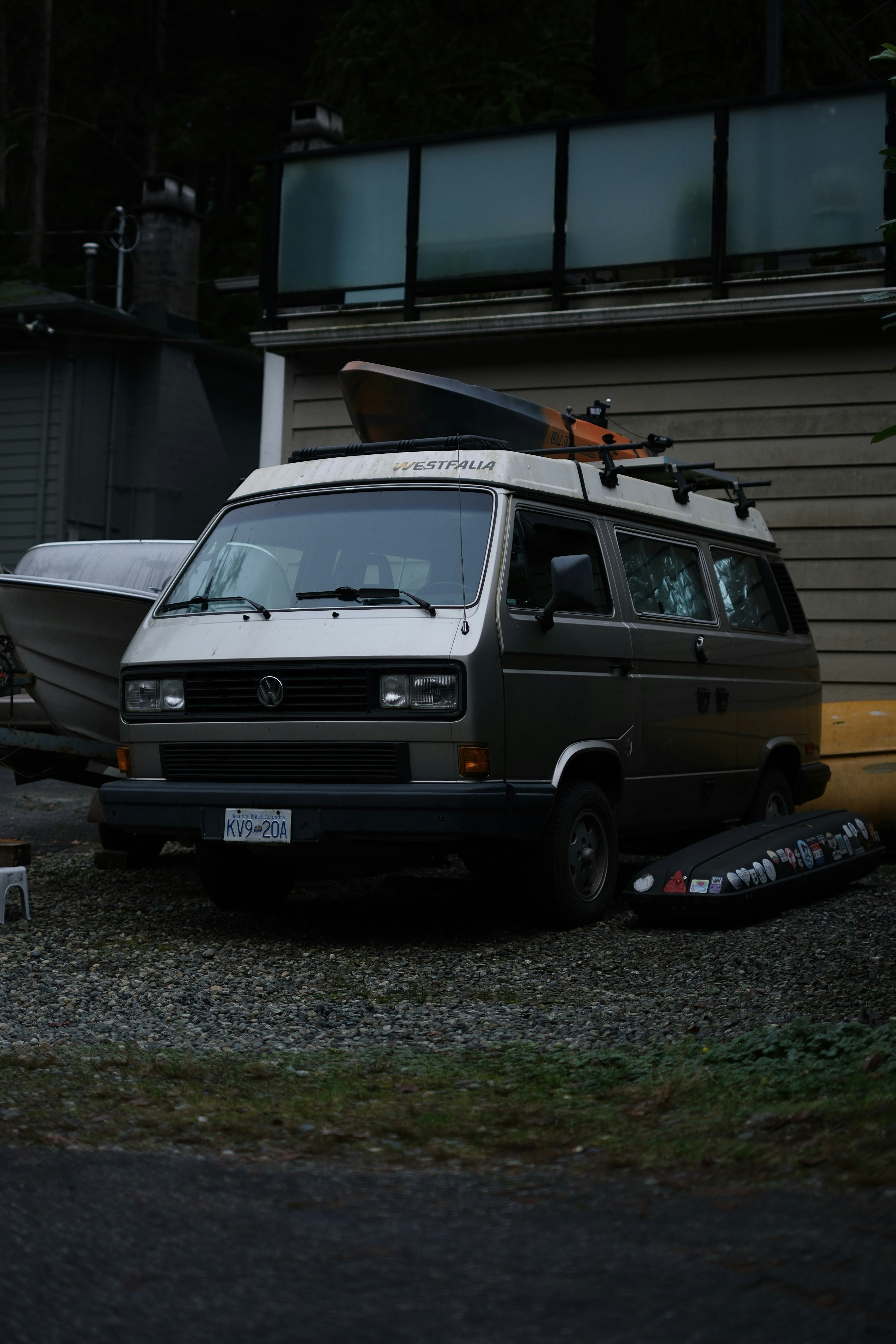 Resting Van by the Lake: Surfboard Ready in the Evening Dark