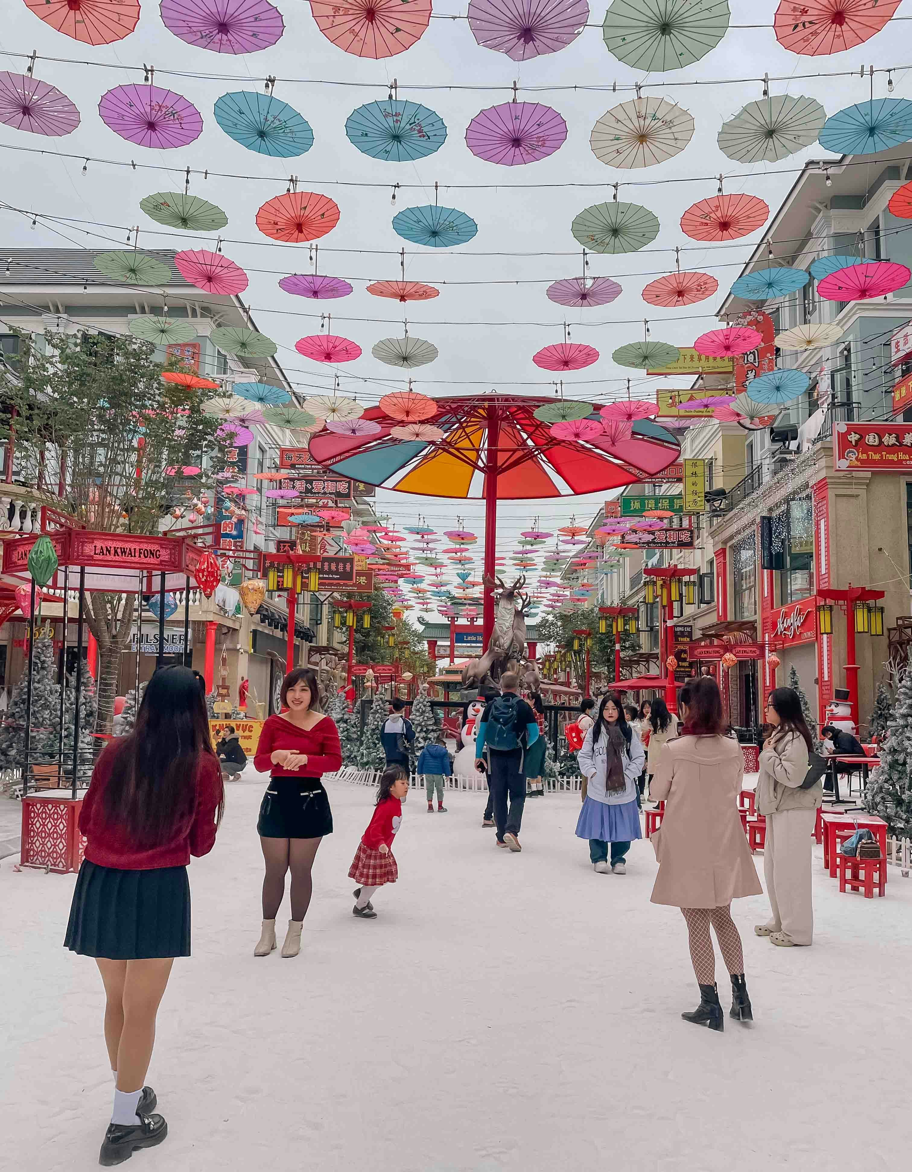 Colorful Lanterns Over a Pedestrian Street Bathed in Soft Winter Light