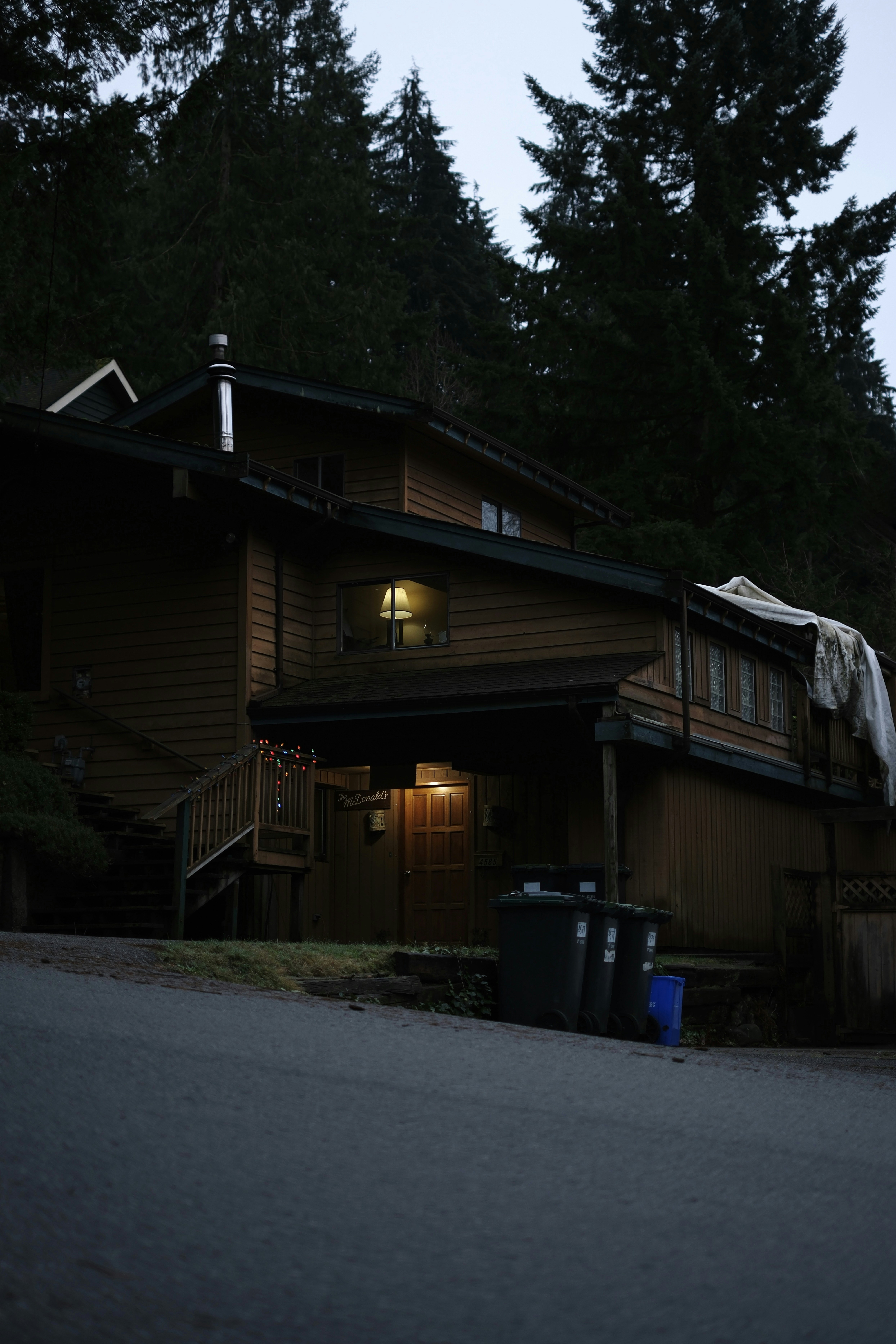 Twilight Cabin: Warm Light Bures Through a Mountain Haven