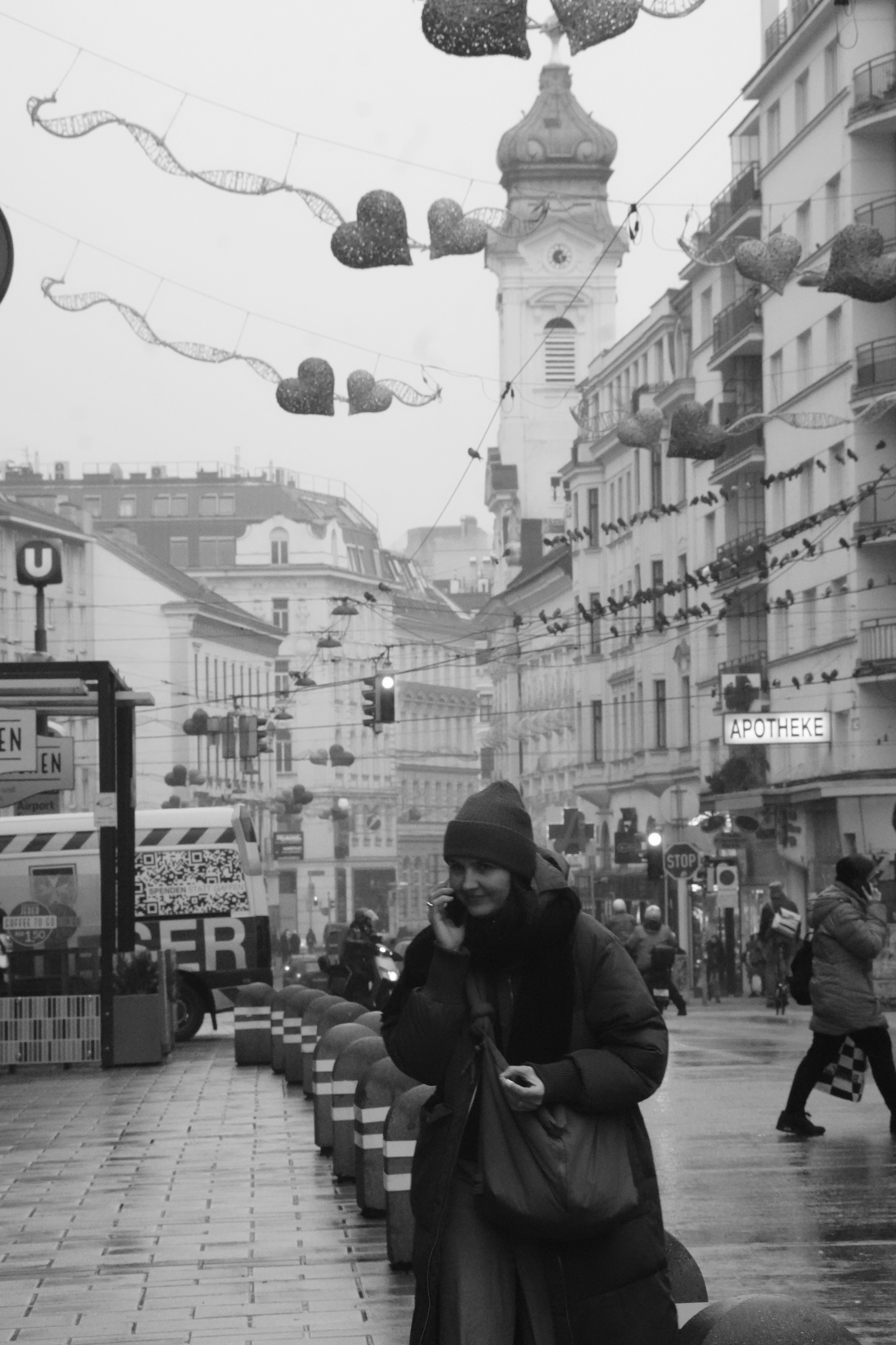 City Street Echoes: Winter Quiet Beneath Festive Canopies