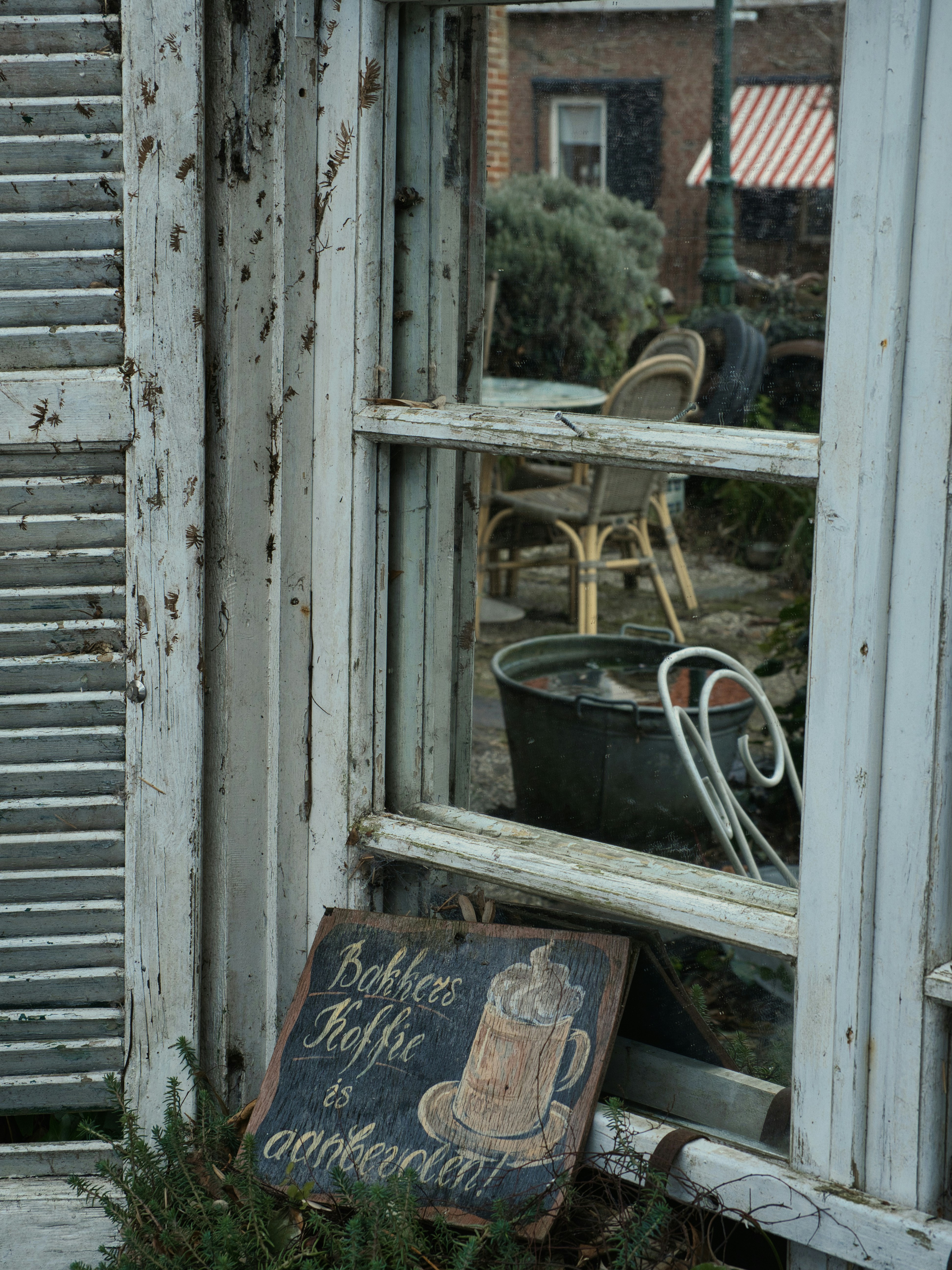 Weathered Window and Cozy Café Signage