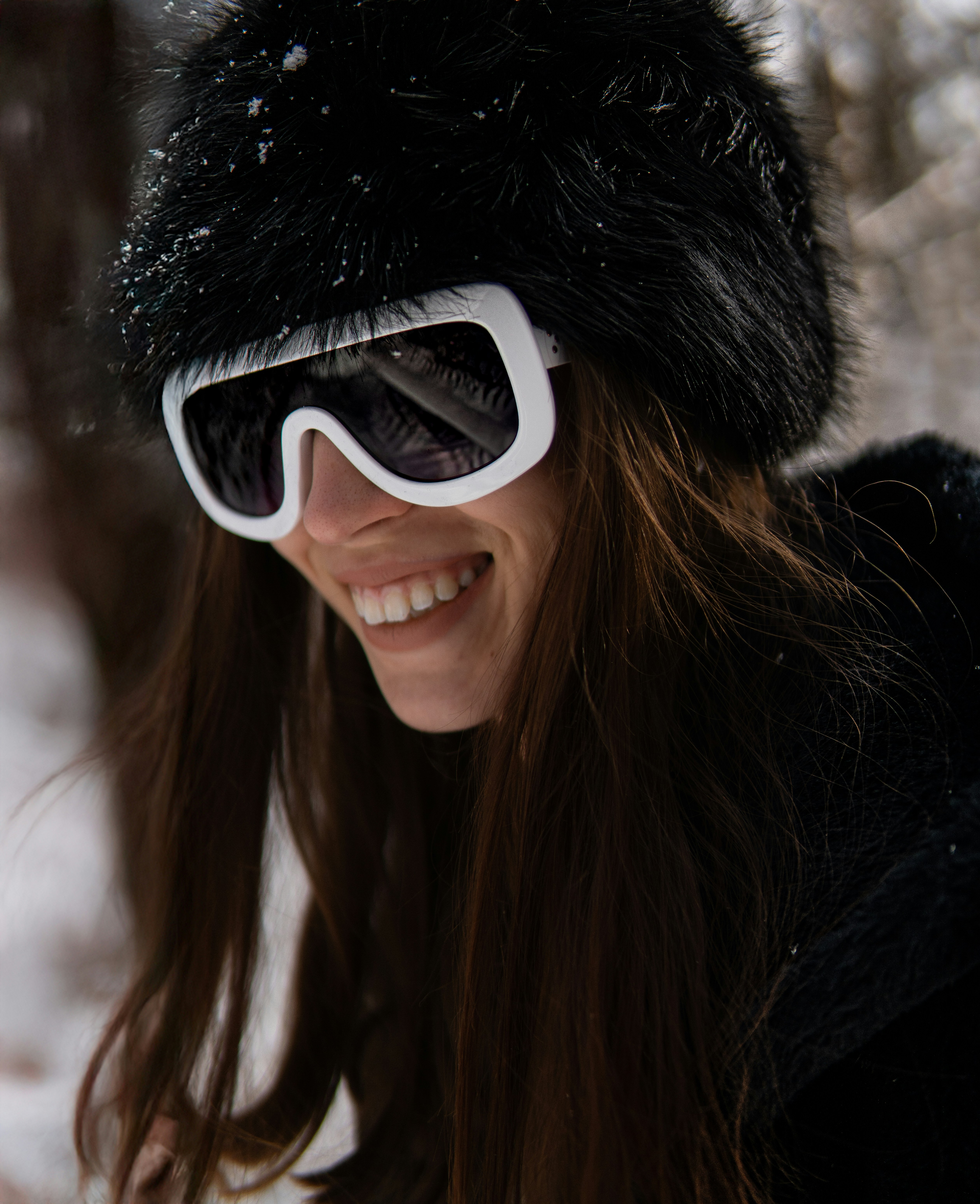 Snowy Gaze: A Smiling Moment in Ski Goggles