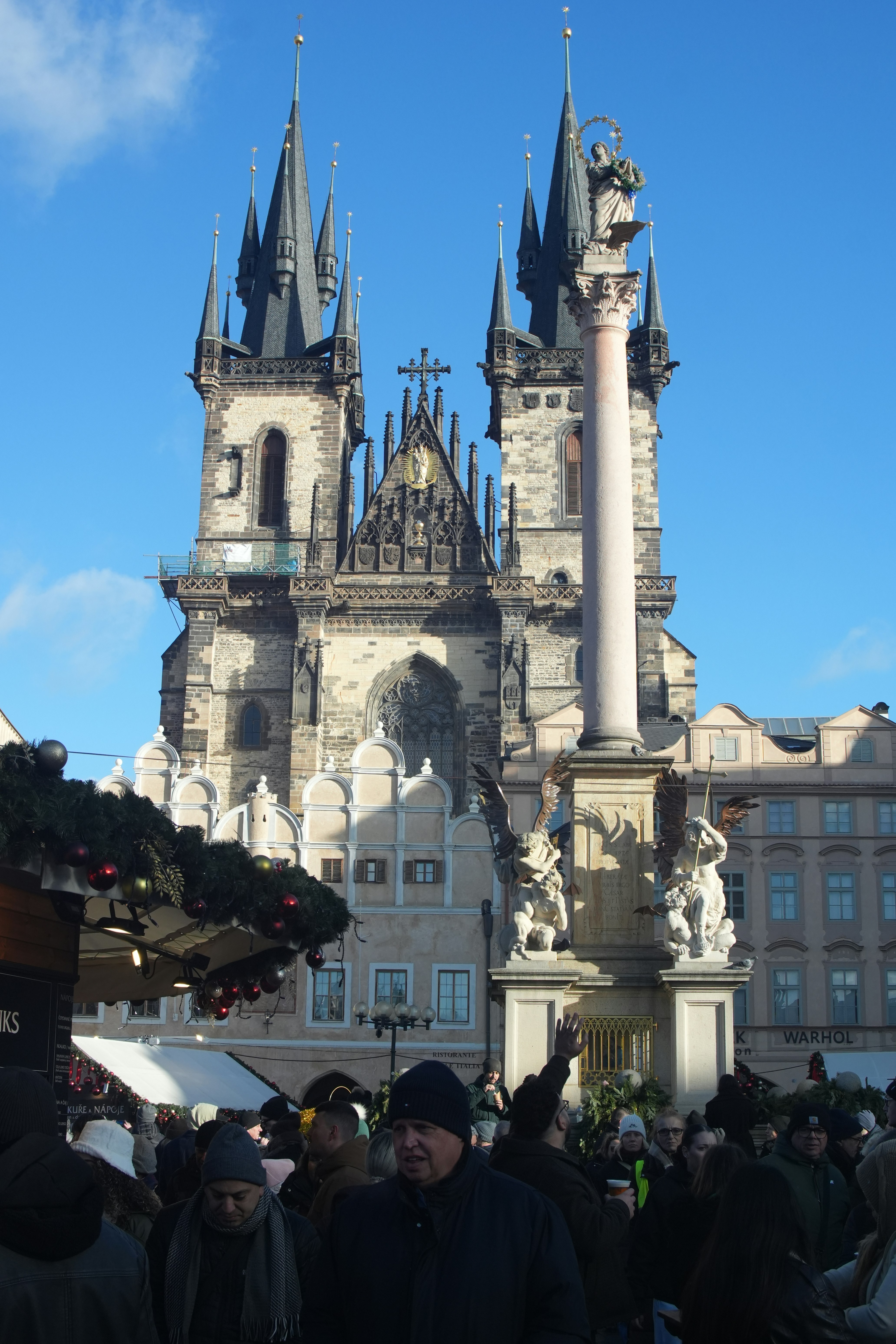 Gothic Cathedral Towers and a Busy Christmas Square