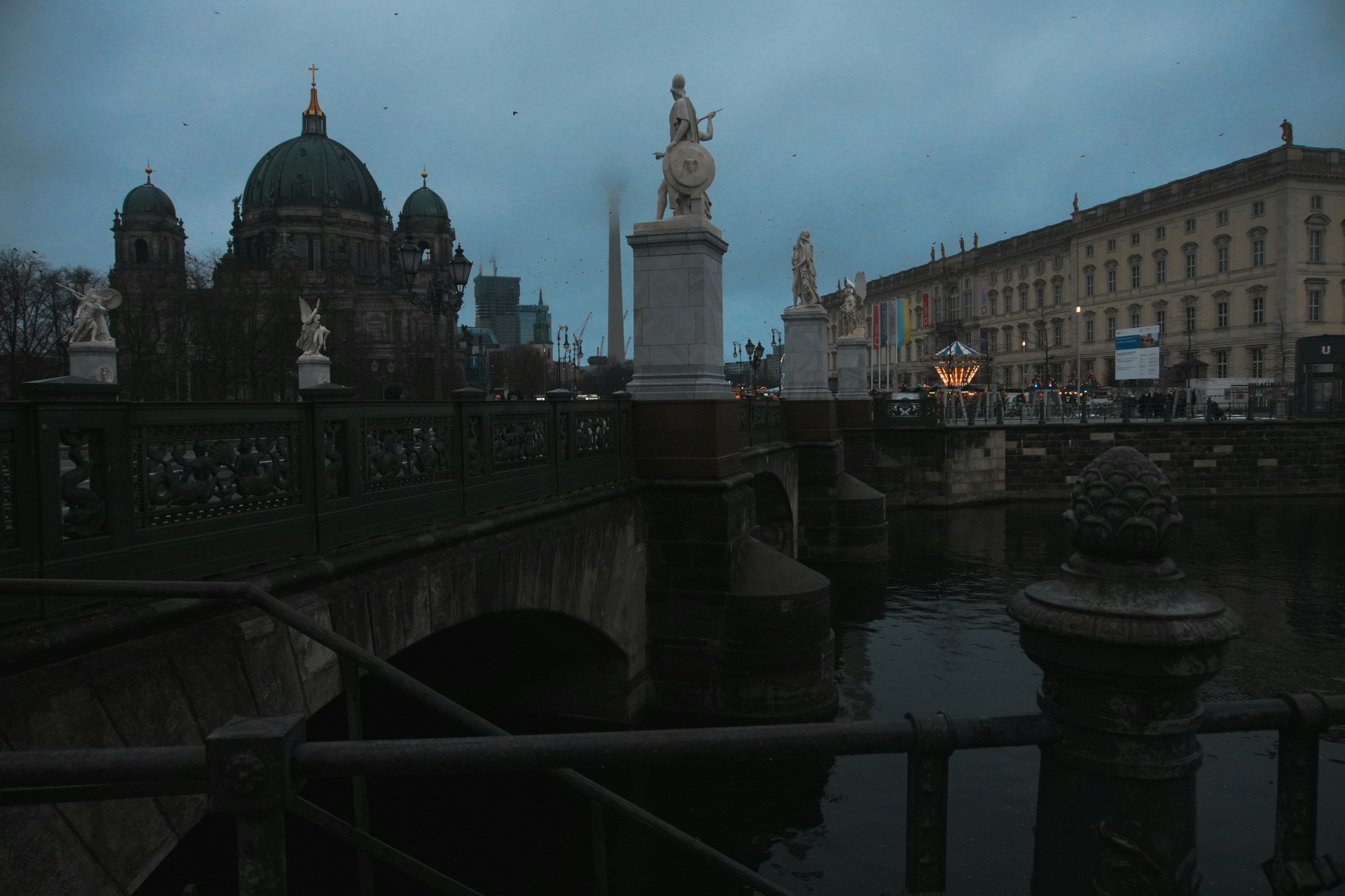 Evening over the Charles: statues, domes, and stonework on Charles Bridge