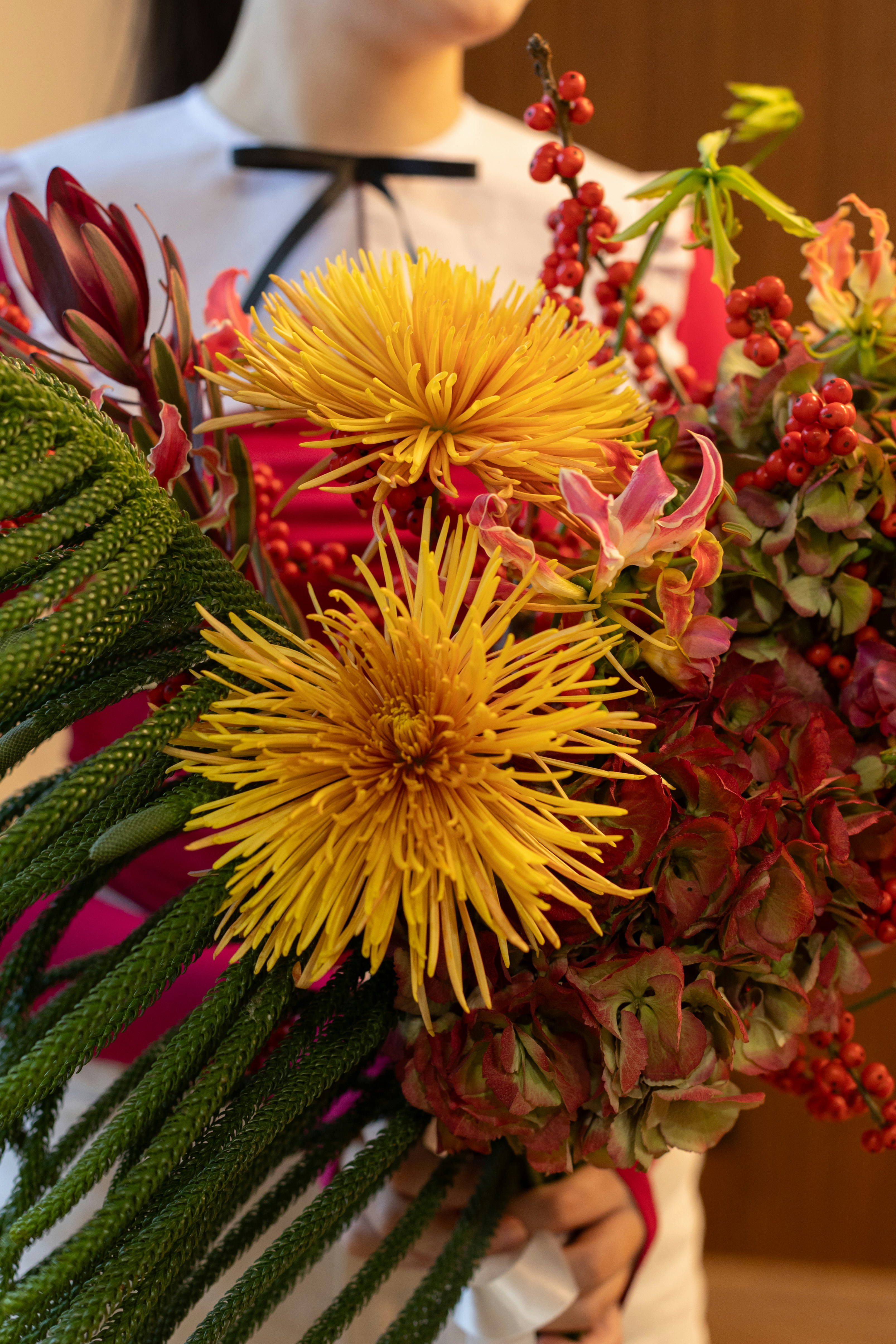 Bouquet in Bloom: Golden Chrysanthemums Framing a Quiet Portrait