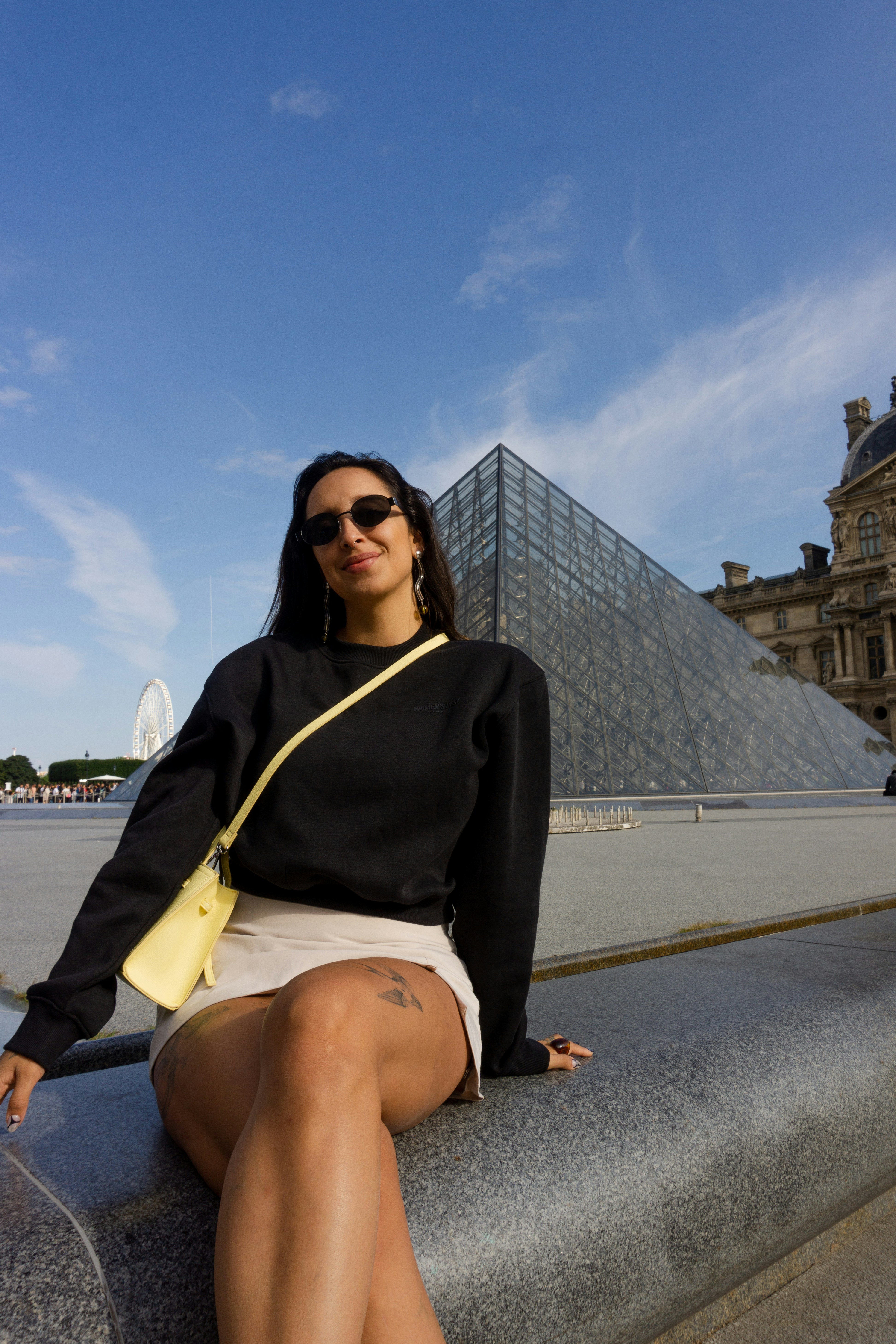 Shadows and Glass: A Street-style Moment by the Pyramid