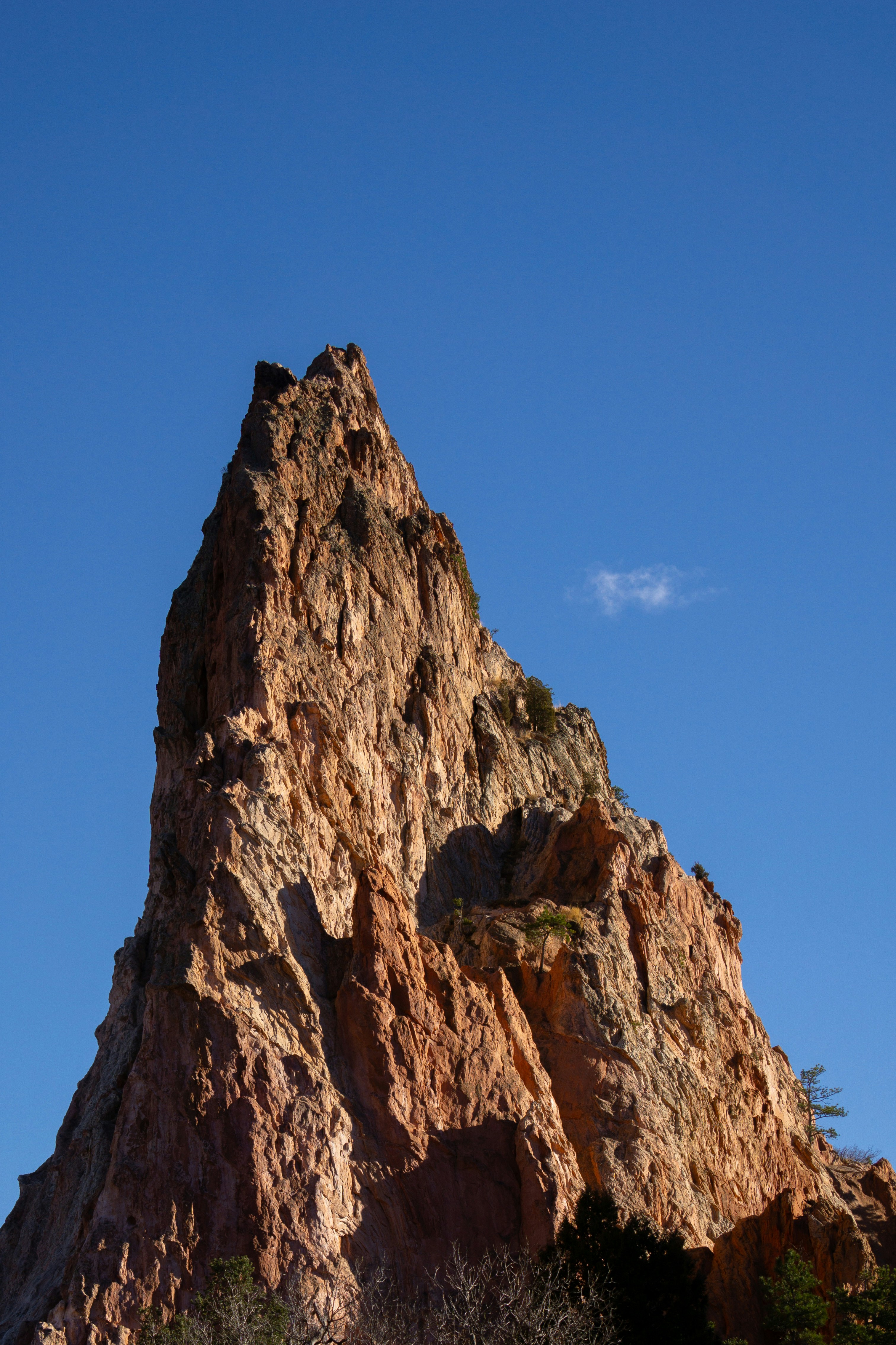 Rising monolith under a clear blue sky