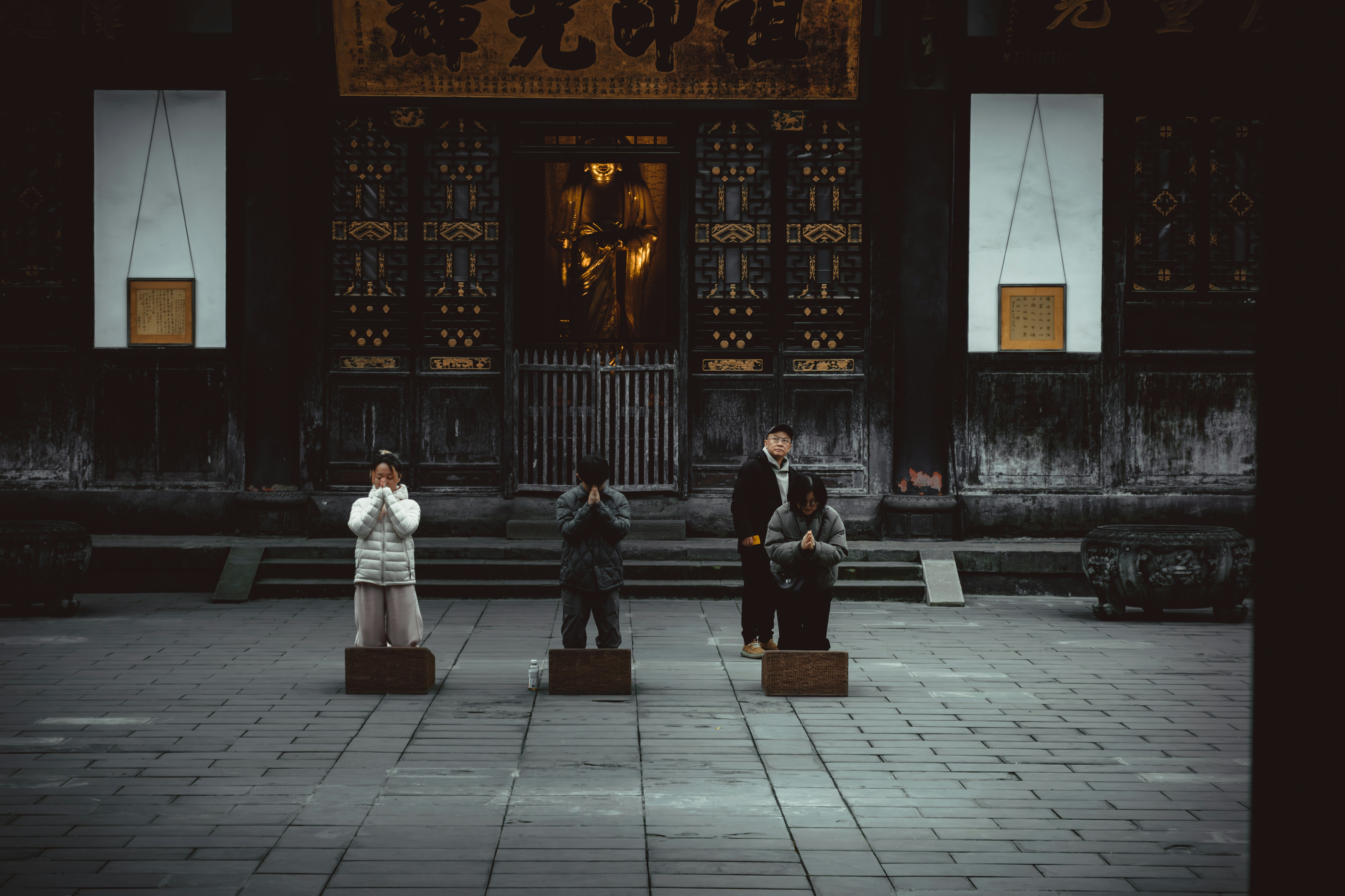 Quiet Devotion Before the Lanterned Shrine