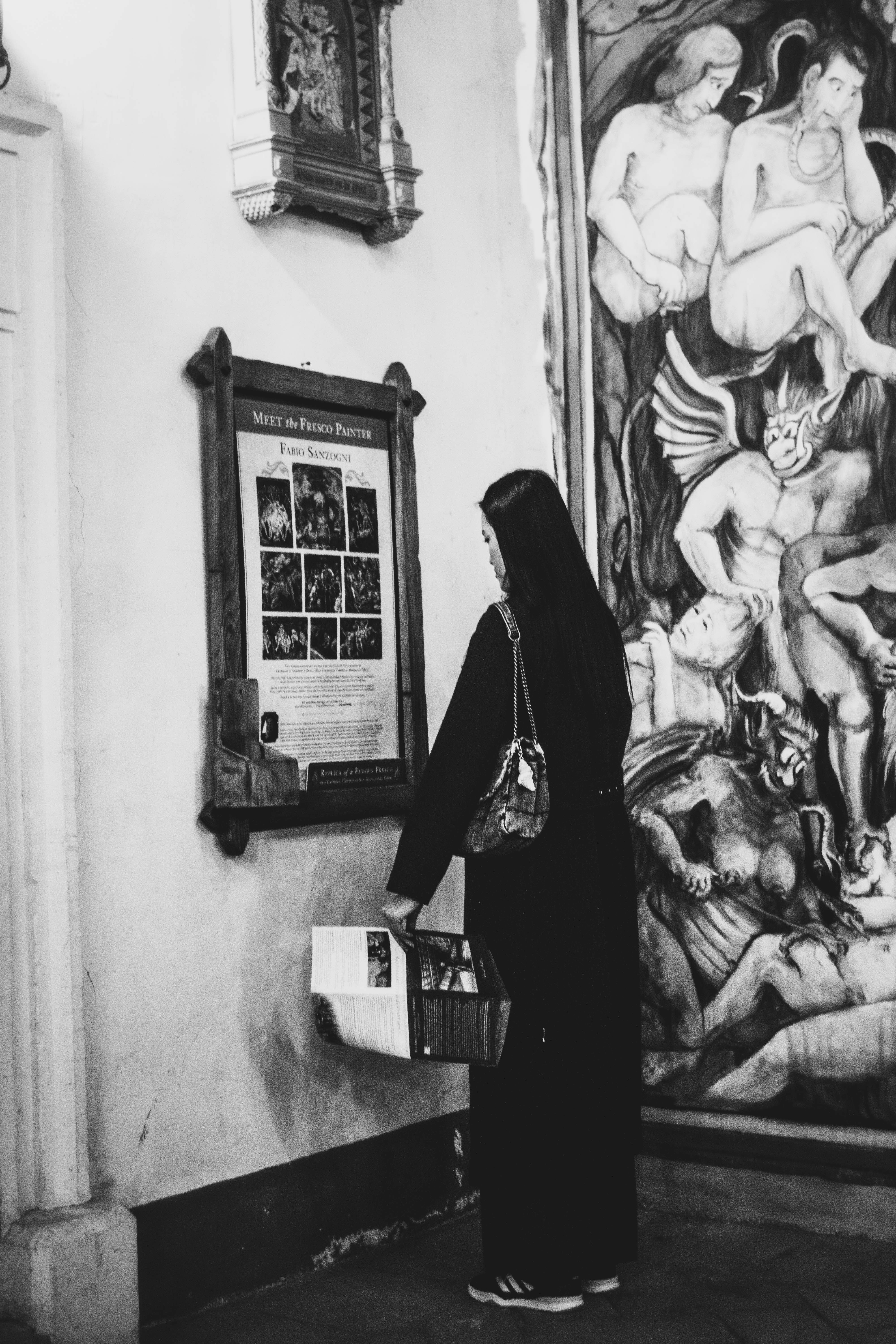 Reader at the Framed Gallery: A Monochrome Moment