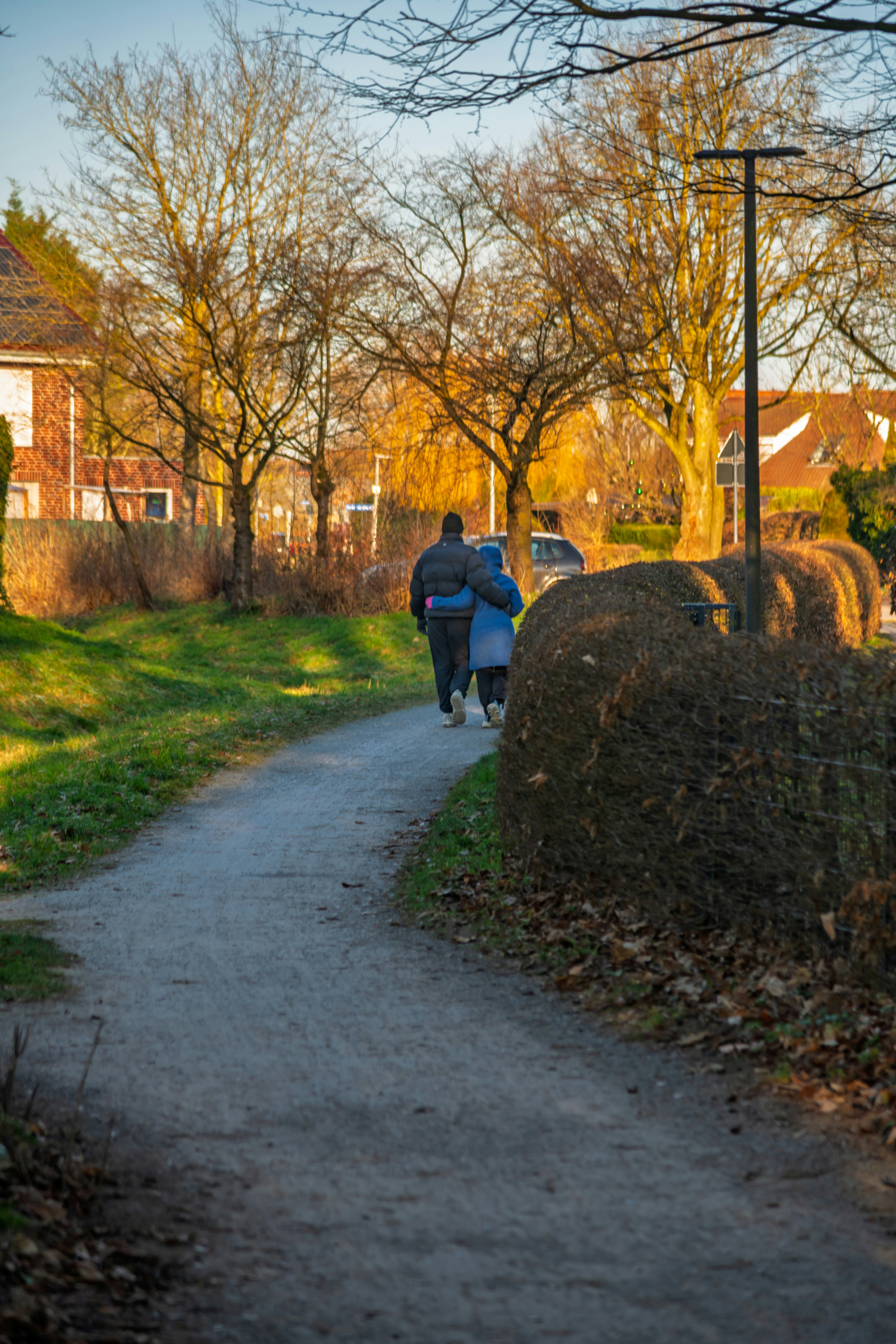Two Hands, One Path: A Riverside Stroll into Evening Light