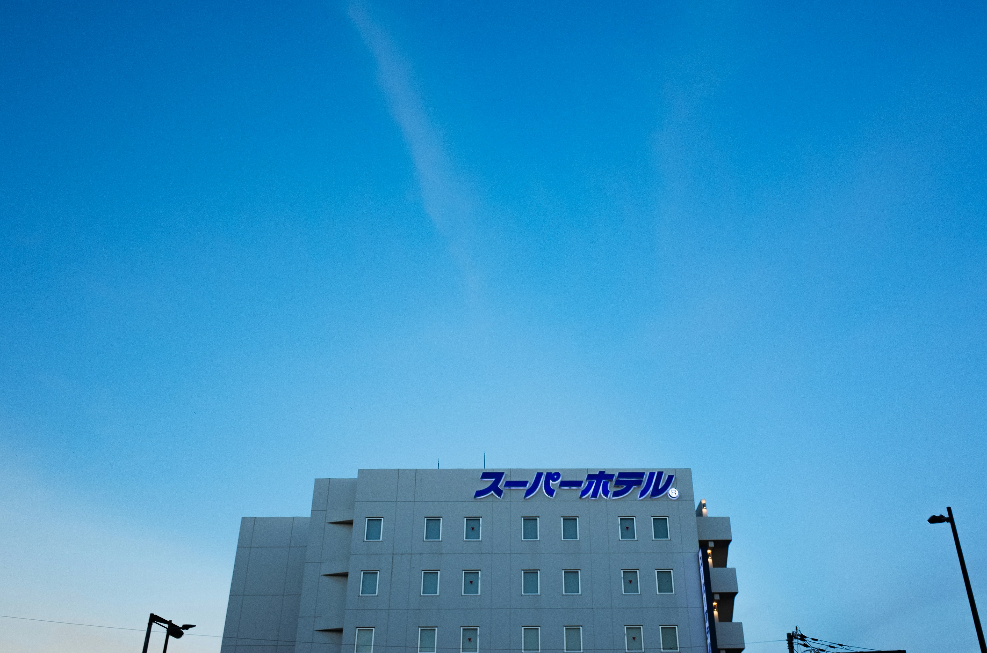 Blue Sign, Grey Hotel: A Quiet Cityrise