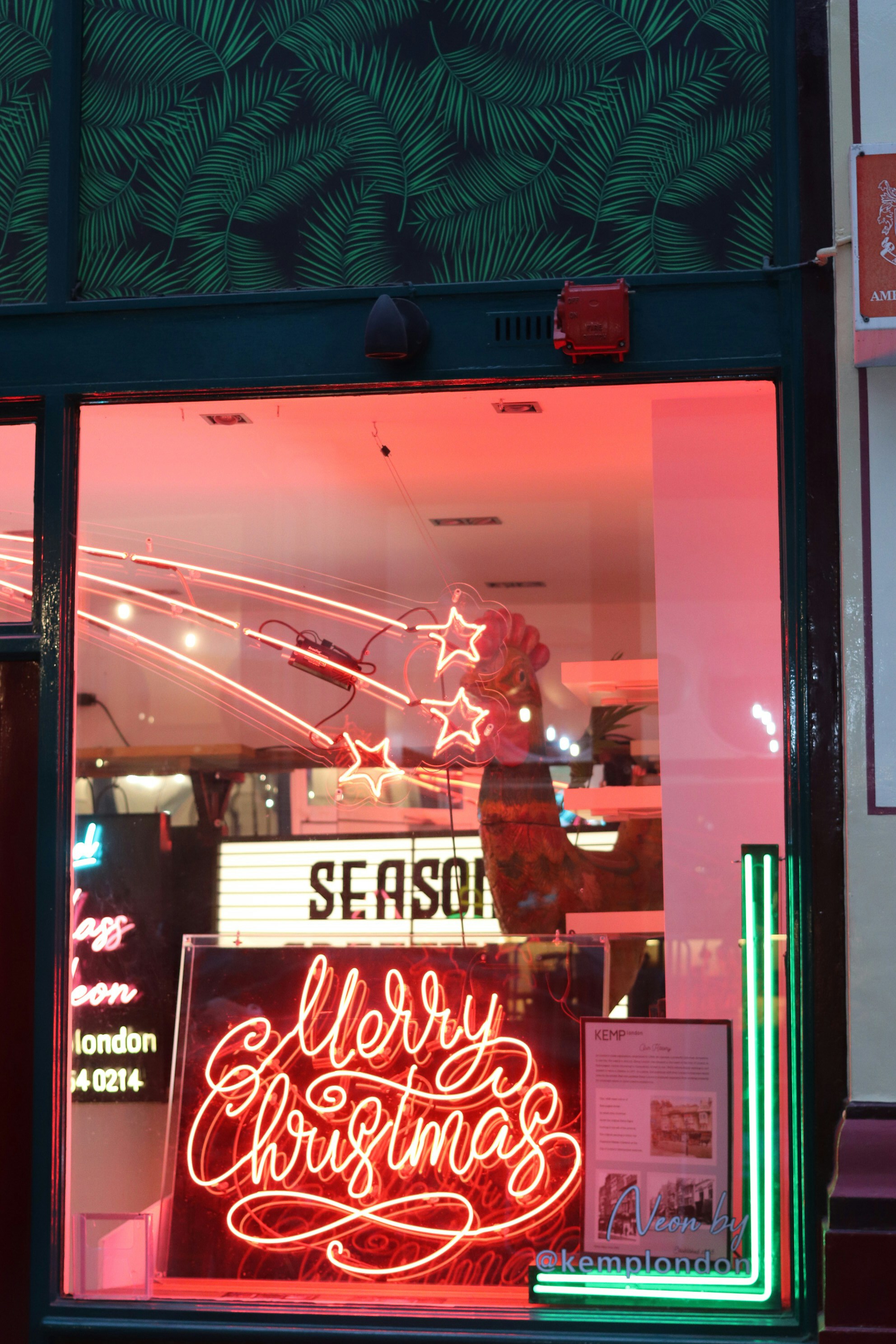 Neon Holiday: Red Script and Seasonal Neon in a Storefront Window
