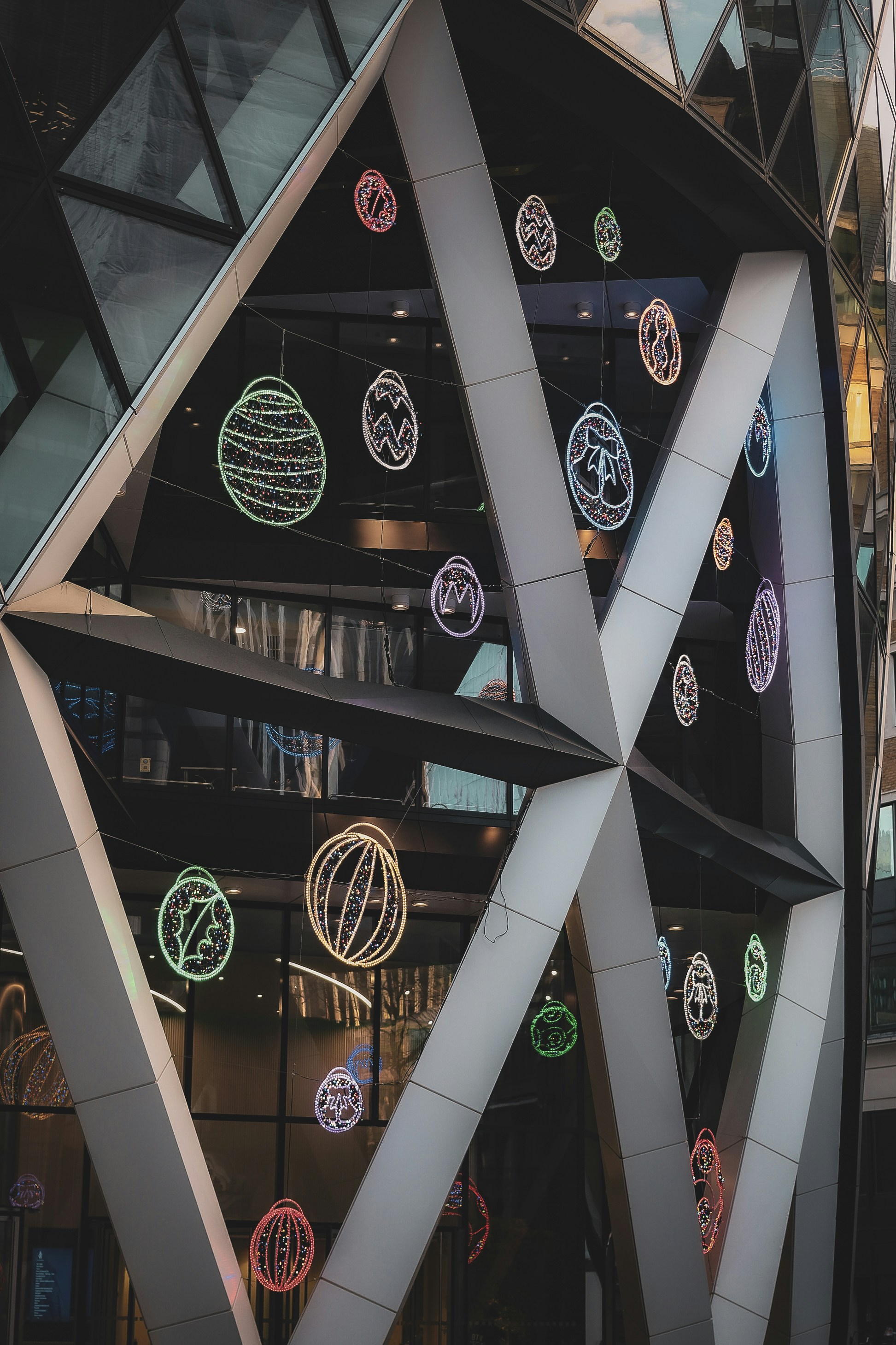 Neon Orbits on Glass Facade
