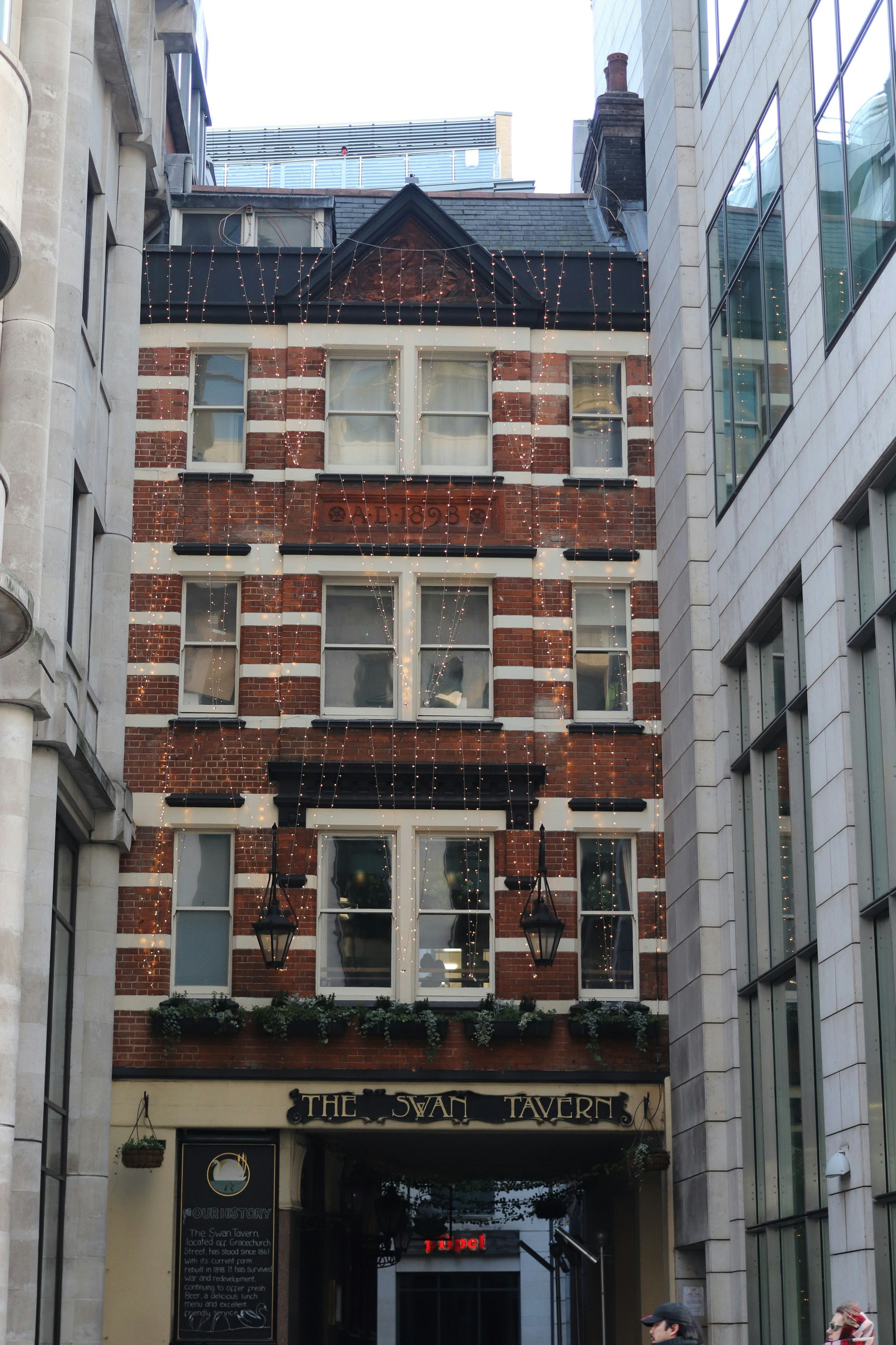 Street-level Facade: The Narrow Archways of The Swan Tavern