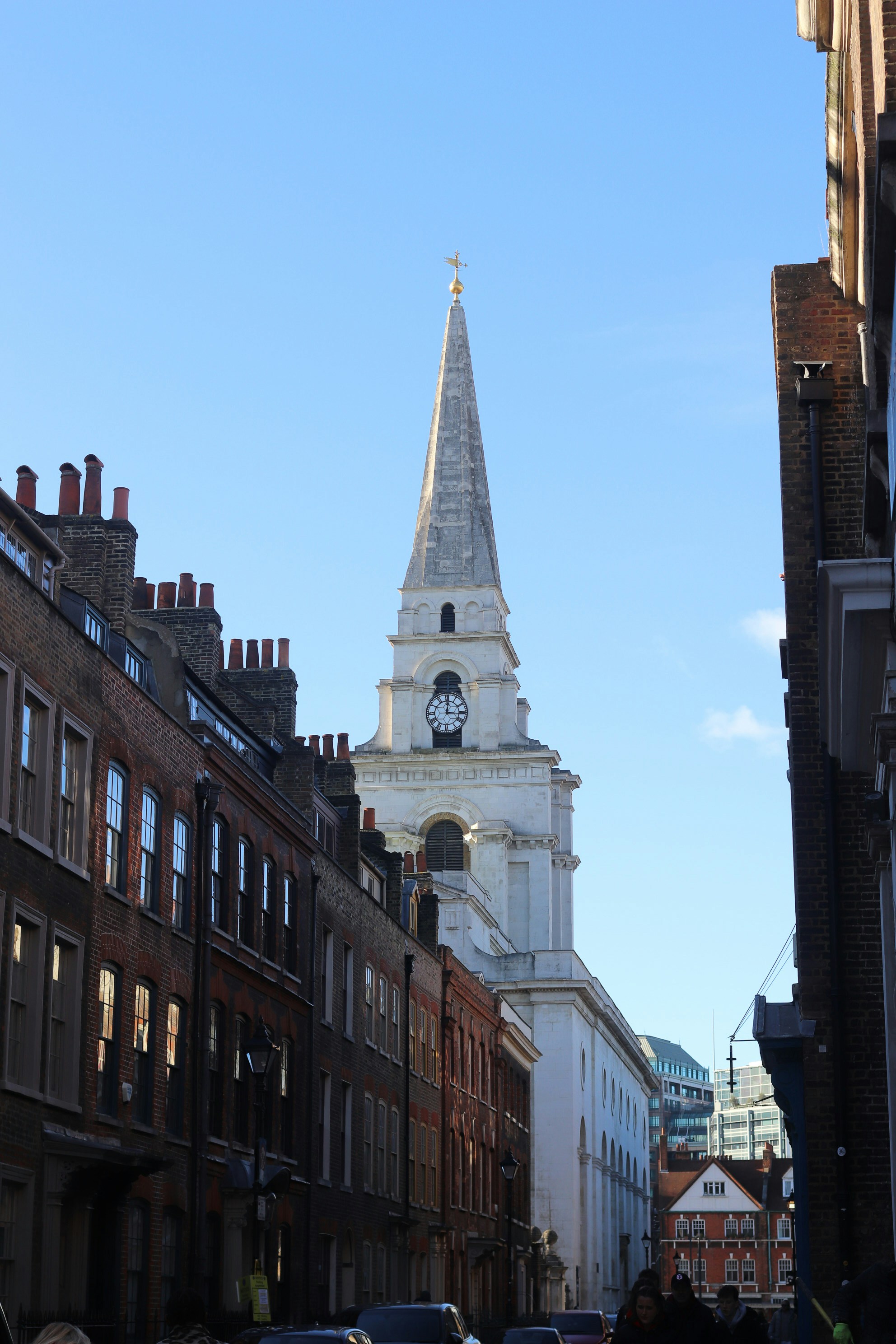 Stately Clocktower Pierced by a Narrow Street
