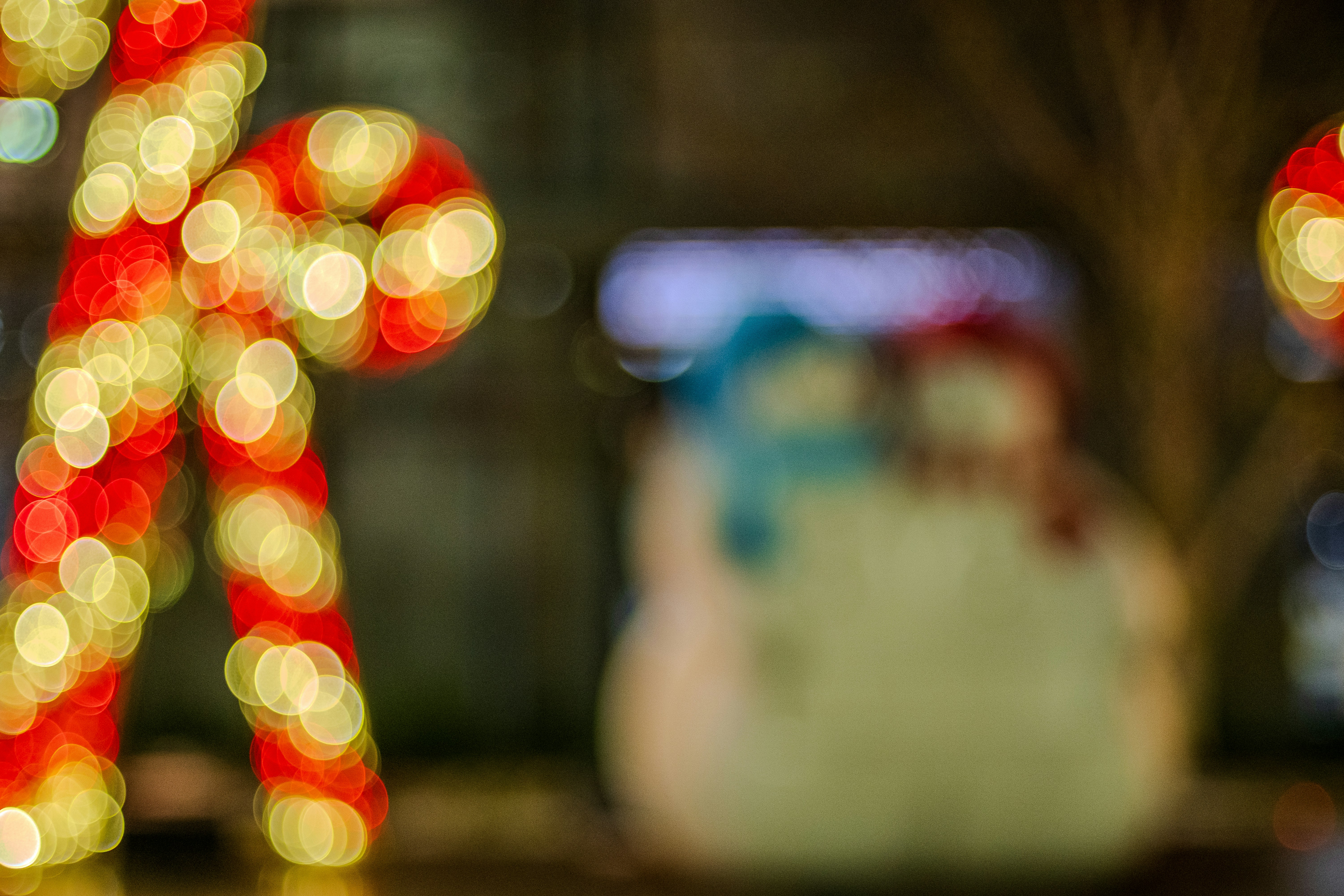 Soft Glow of Holiday Lights and Snowman Blur