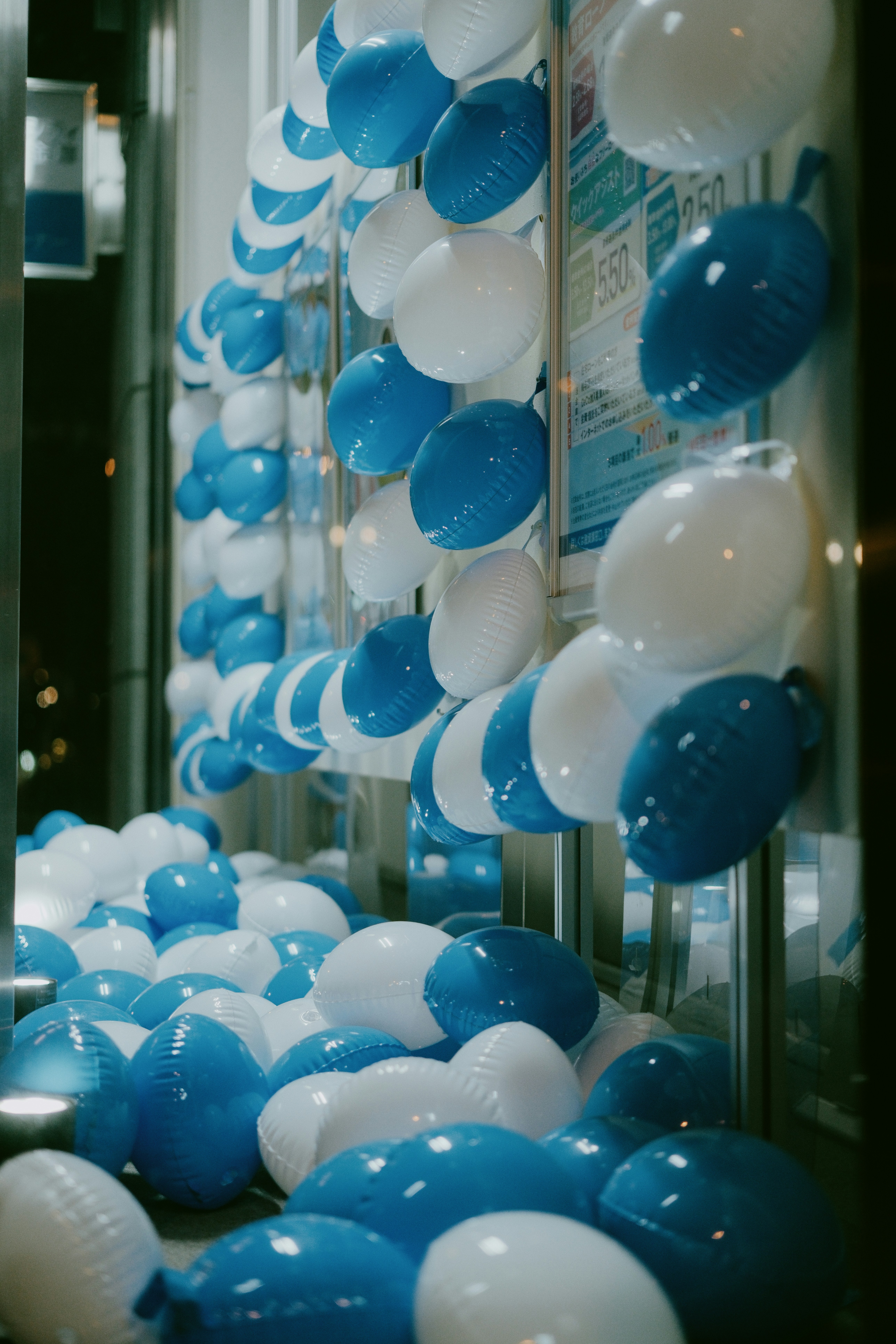 Balloon Cascade on a Glass Facade