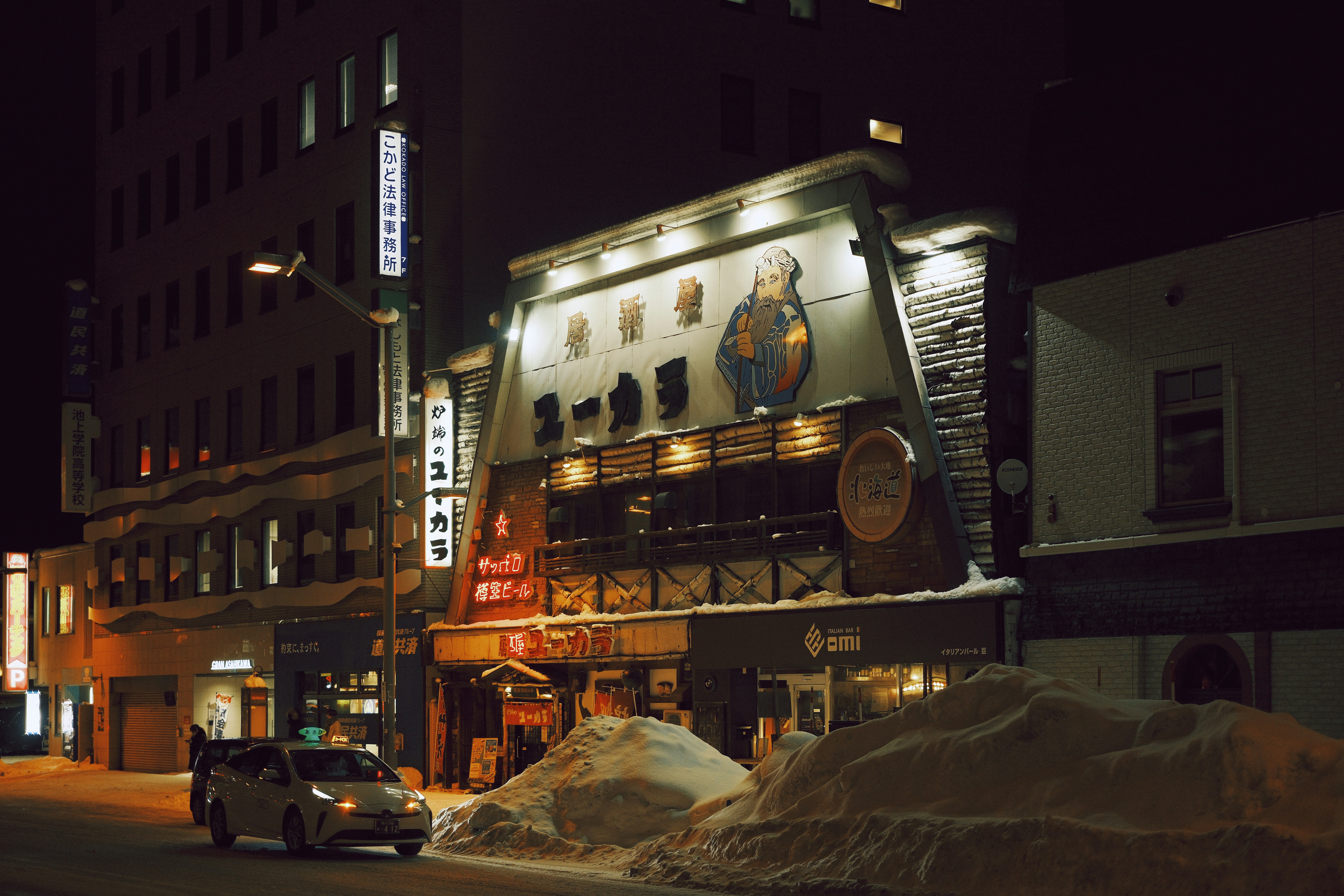 Neon Lanterns and Snow: Nightlife Outside a Japanese Eatery