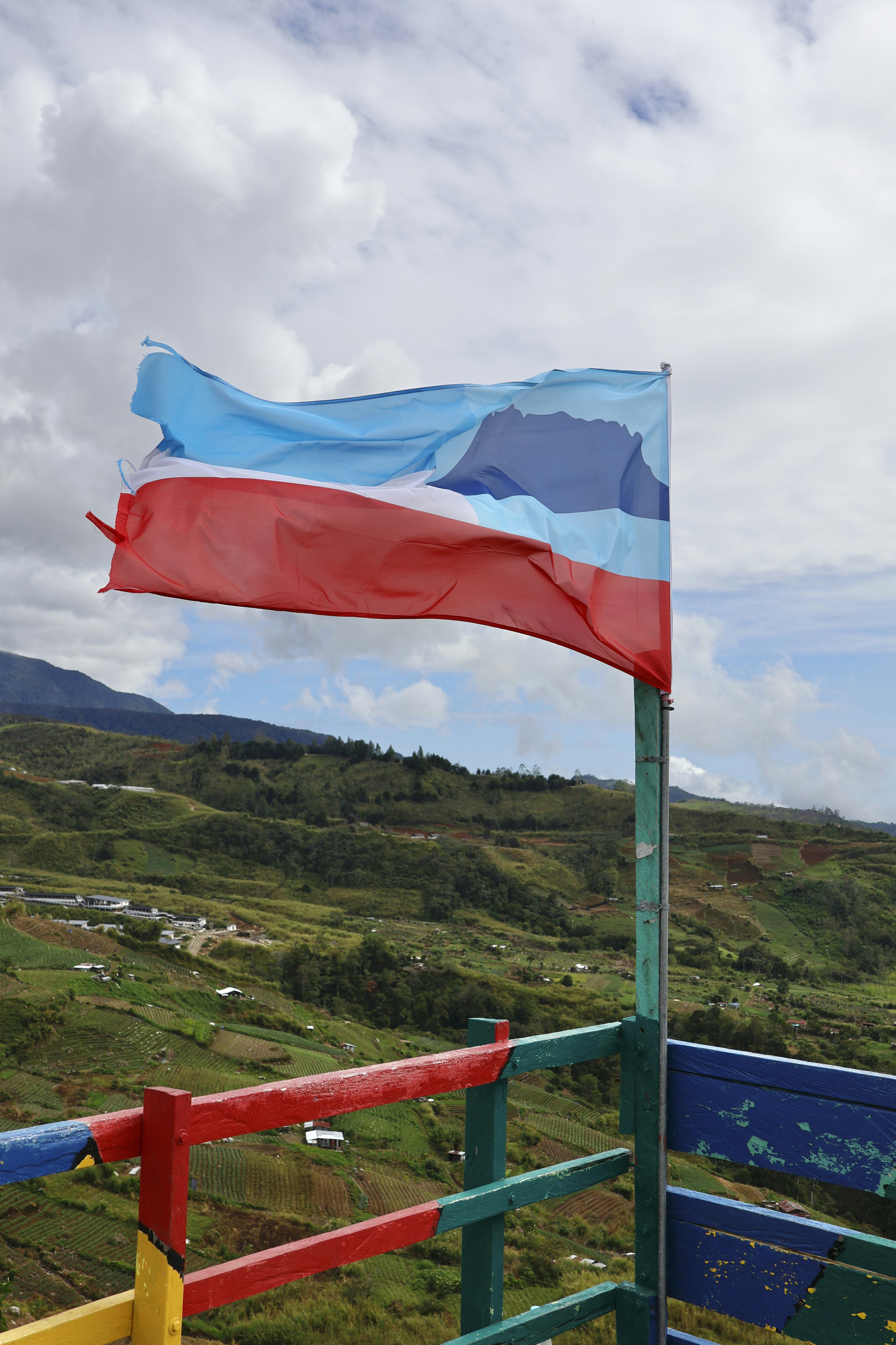 Flag Overlook: Colorful Railings and Rolling Hills