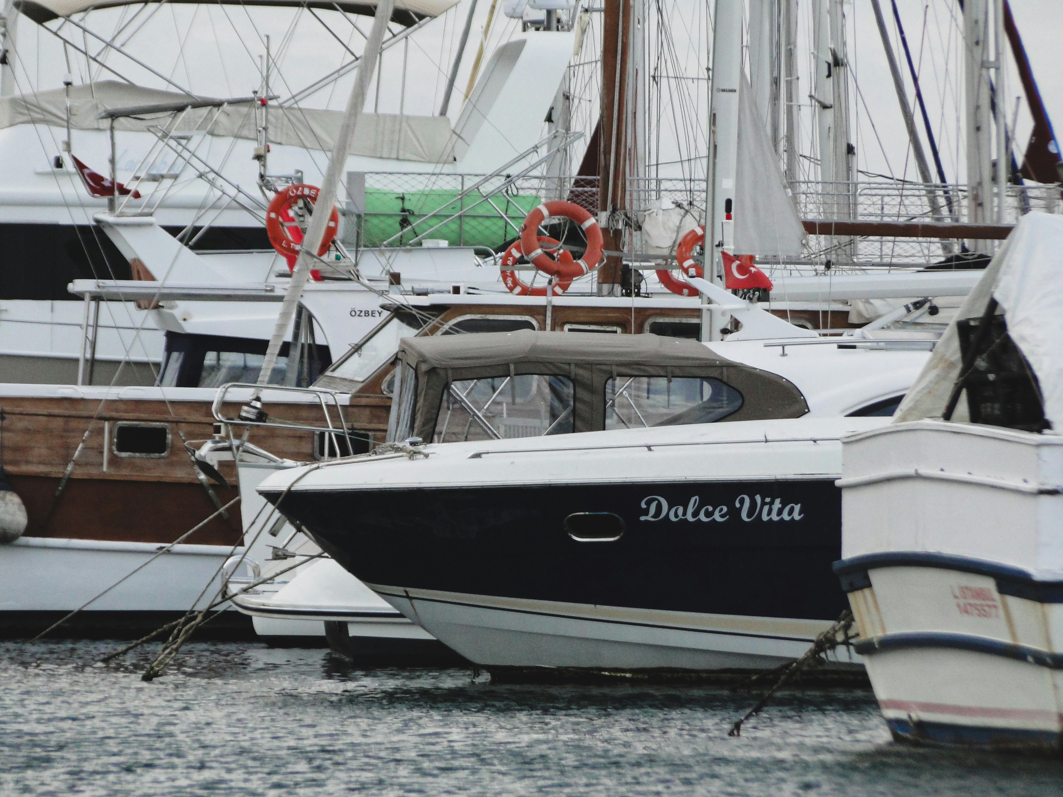Several boats docked in a harbor.