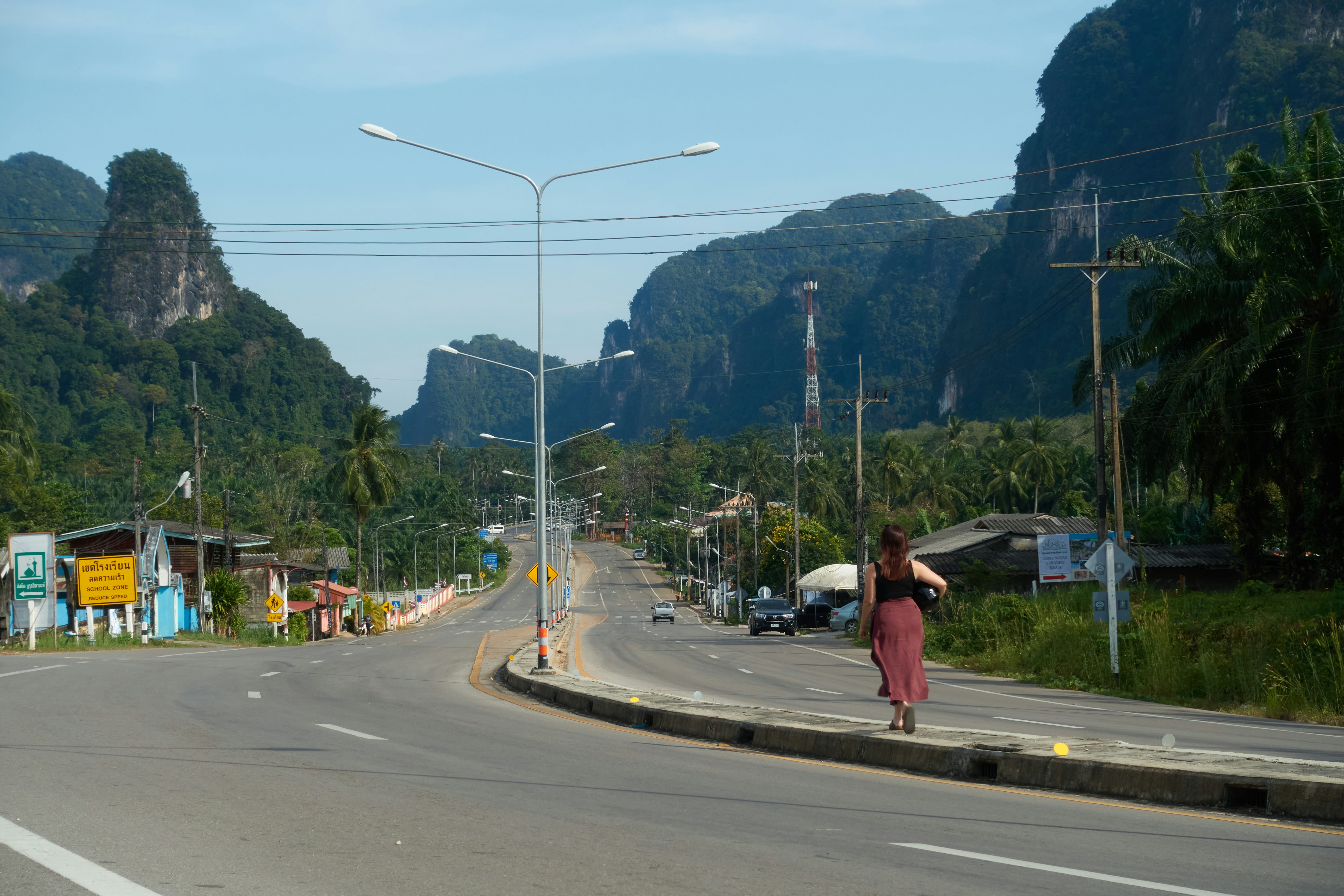 Woman walking on road with karst mountains background photo – Free ...