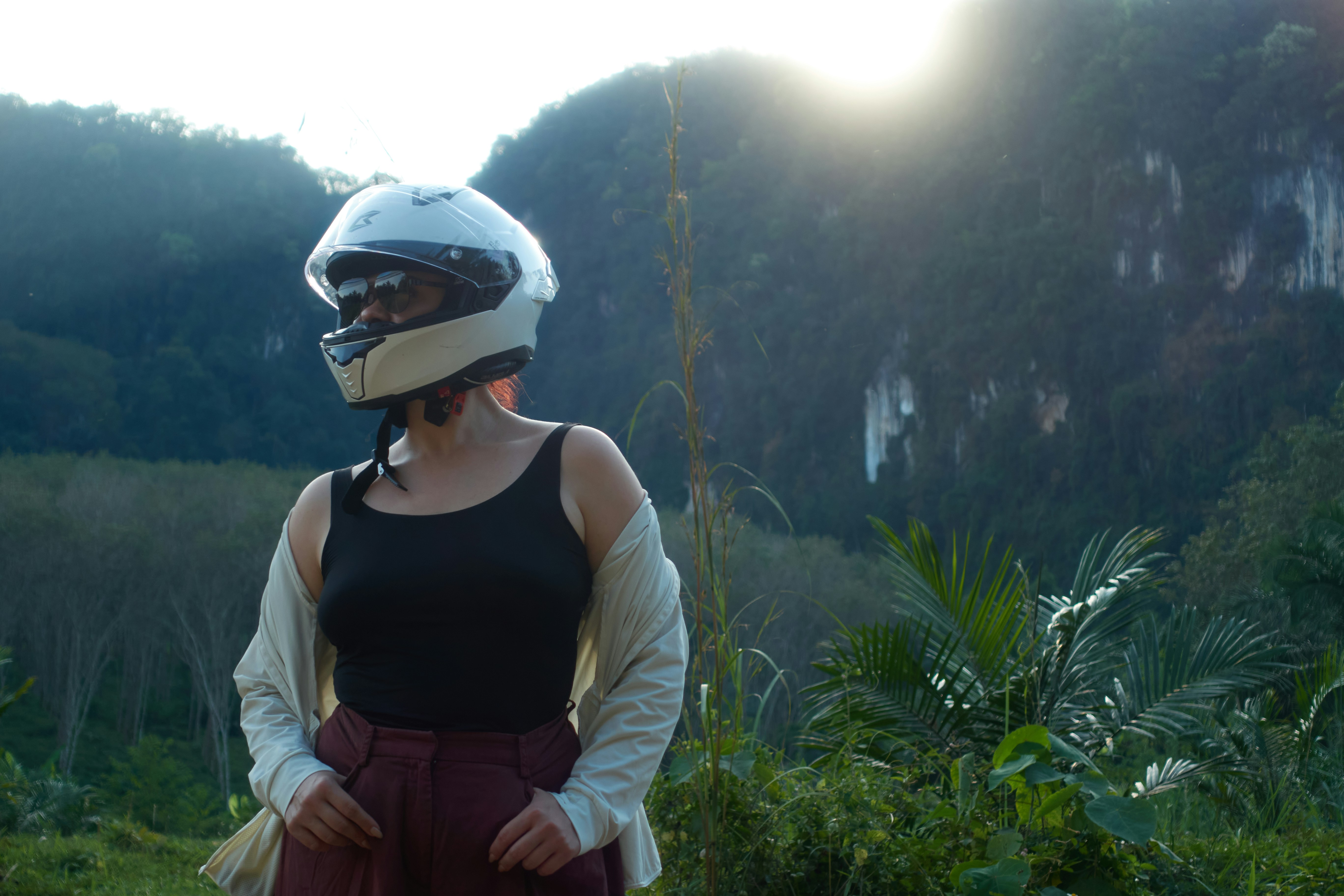 Helmeted portrait in a sunlit valley garden