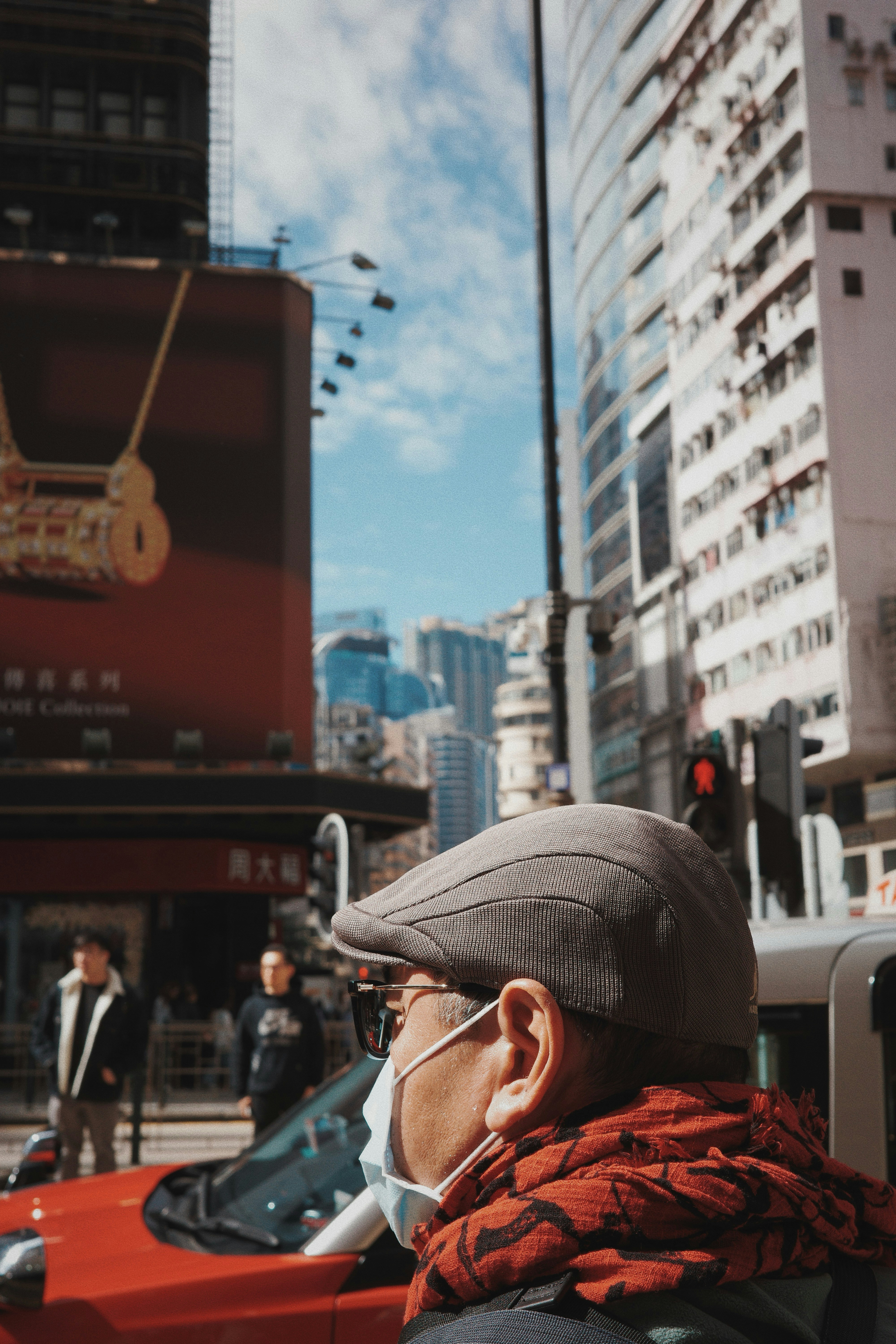 Urban Portrait in Transit: A Masked Observer in a City of Glass and Neon